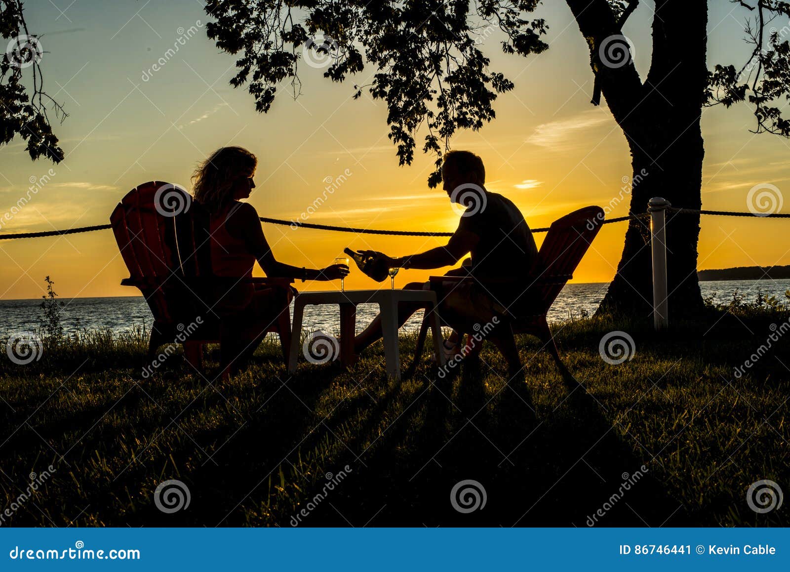 Two people sharing wine editorial photo. Image of sitting - 86746441