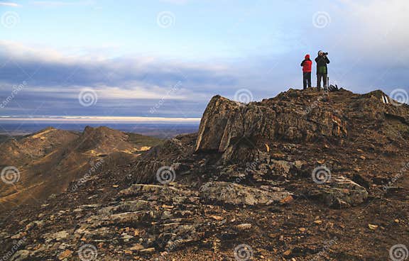 Two People Standing on Top of a Mountain Stock Image - Image of climber ...