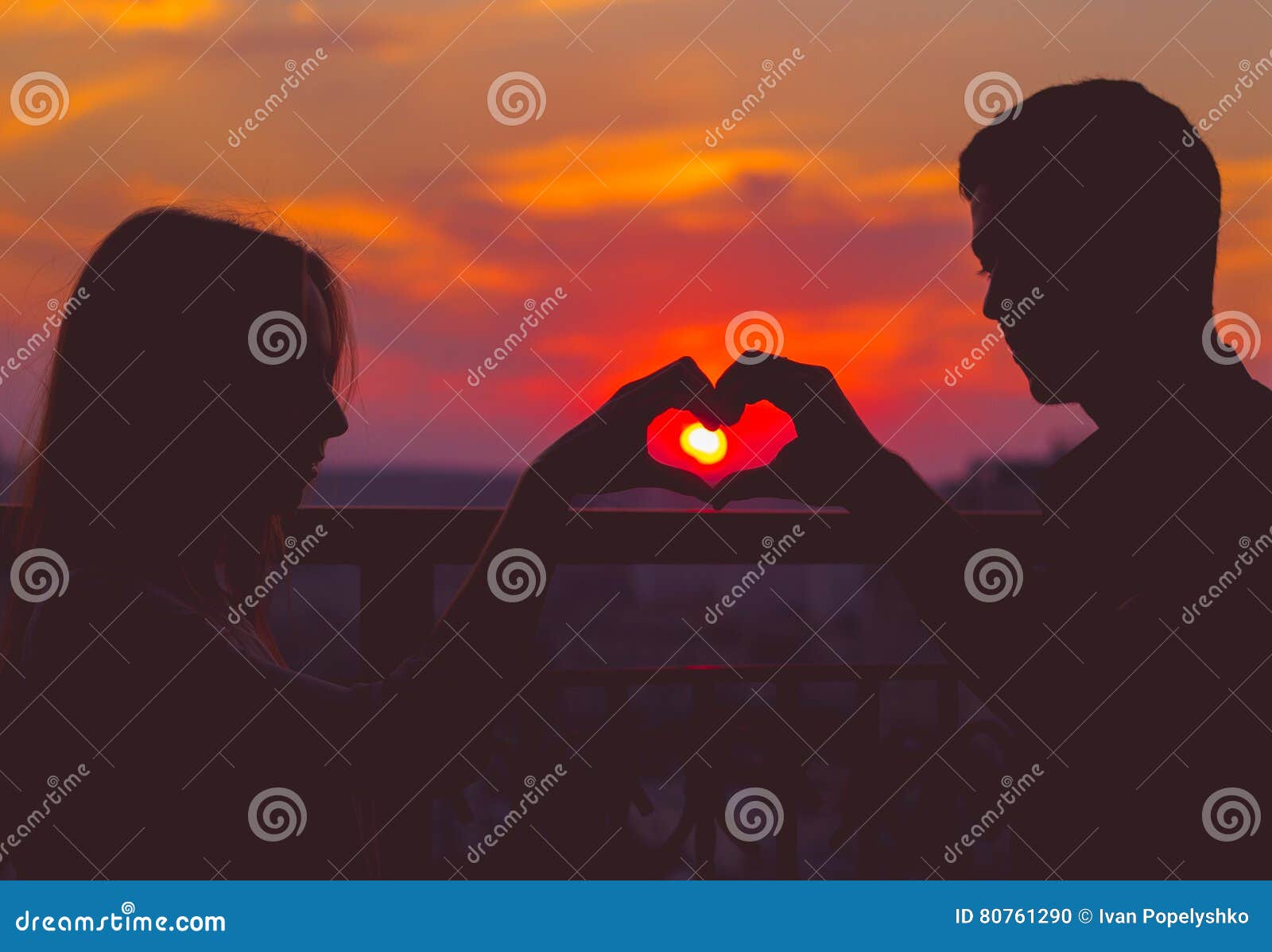 Two people sunset stock photo. Image of clouds, sunrise - 80761290