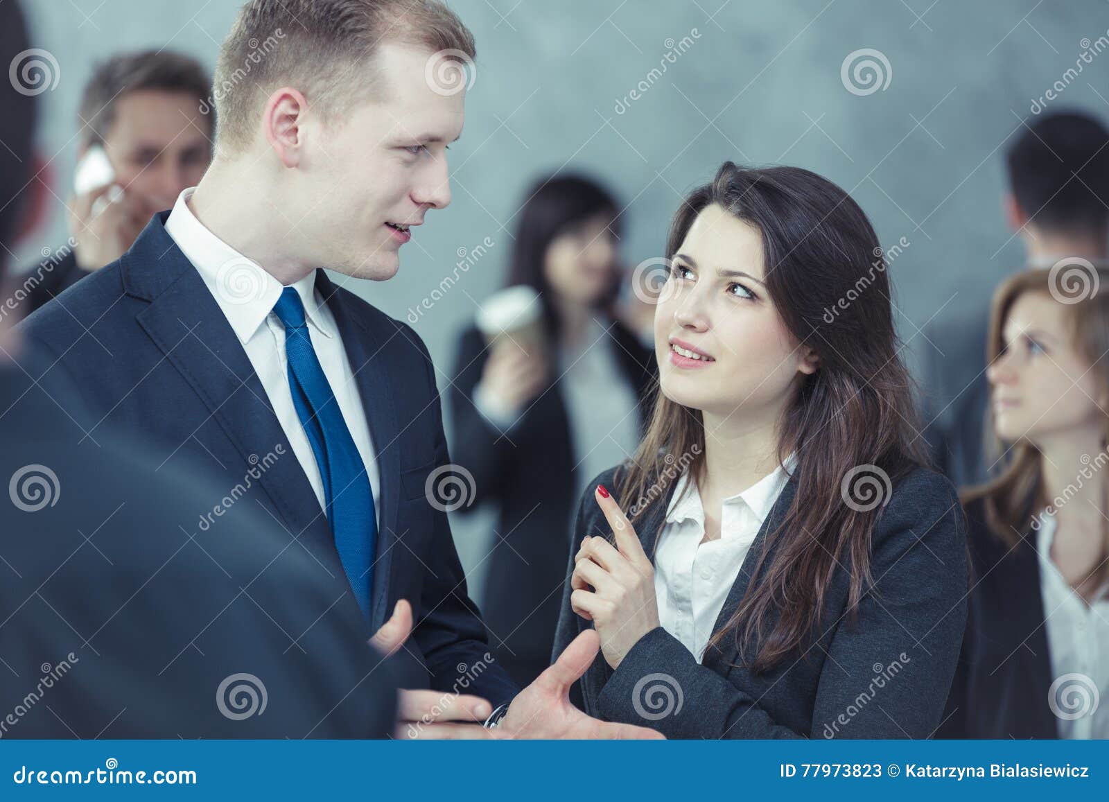 Two People Talking in the Crowd Stock Image - Image of talk, mass: 77973823