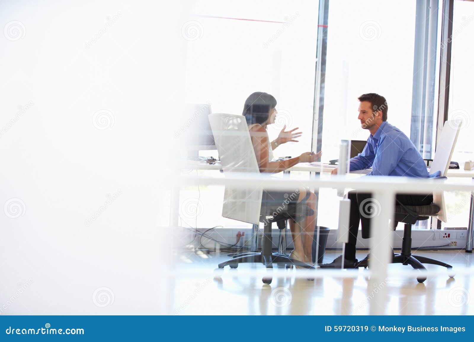 Two People Talking in an Office Stock Image - Image of businessman ...