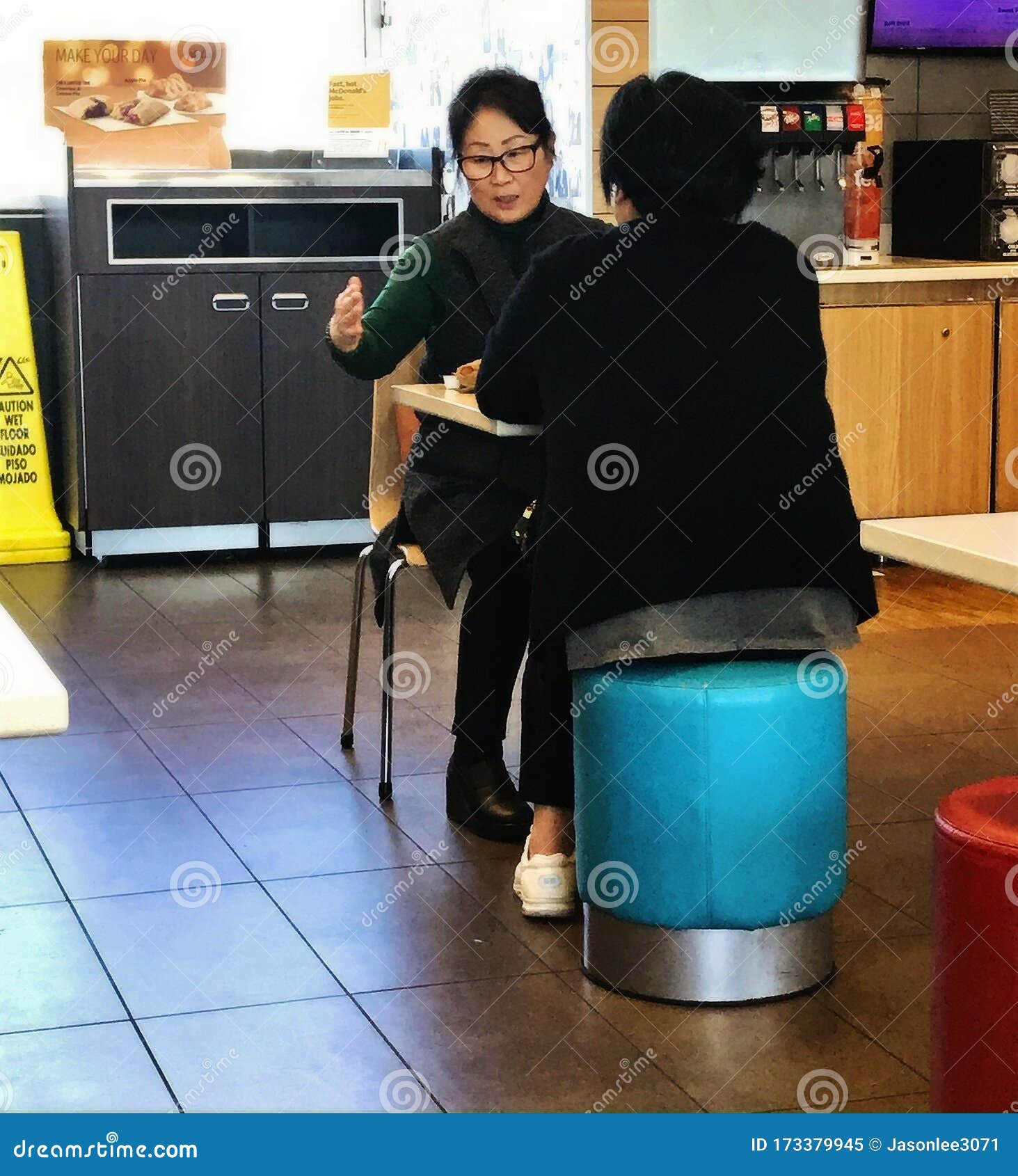 Two people talking editorial image. Image of table, women - 173379945