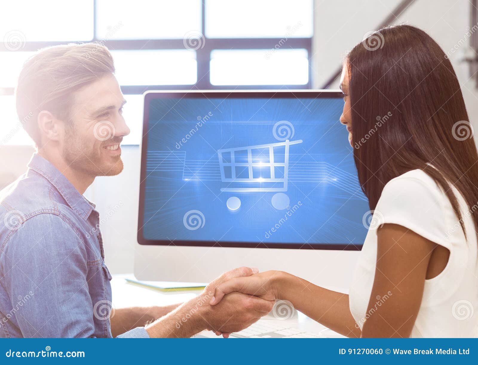 Two People Using Computer with Shopping Trolley Icon Stock Photo ...