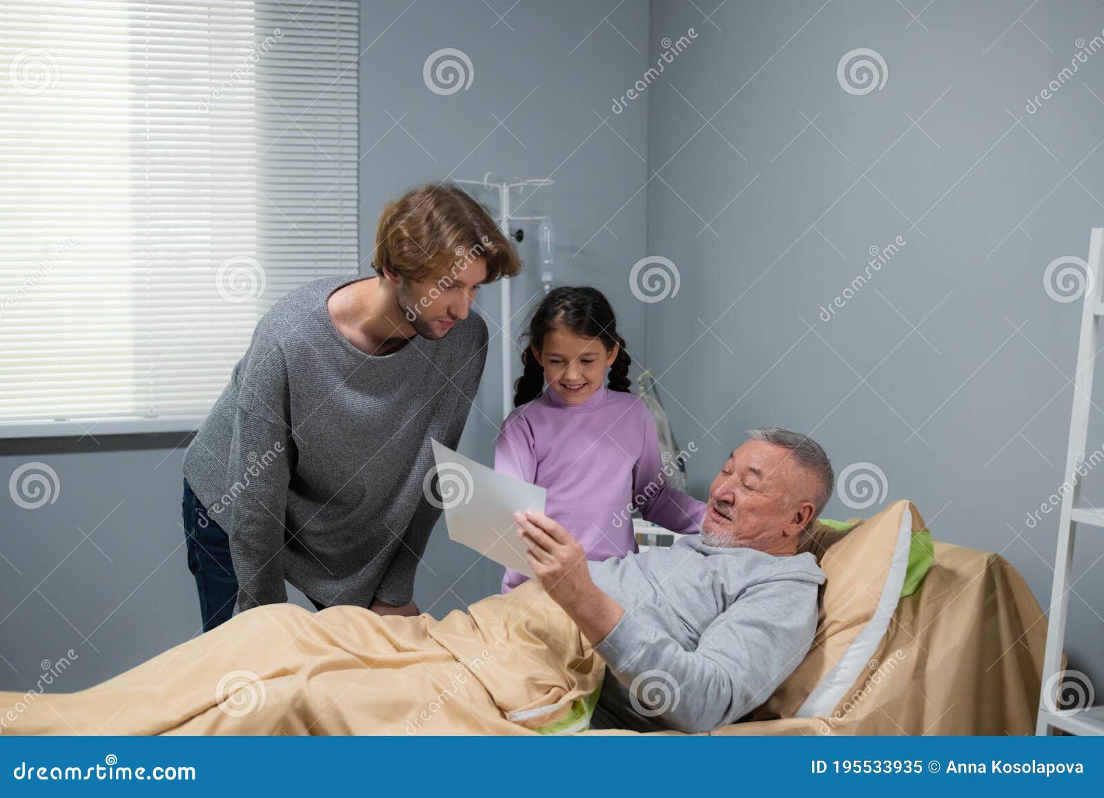 Two People Visiting a Man in a Nurcing Home Stock Image - Image of ...