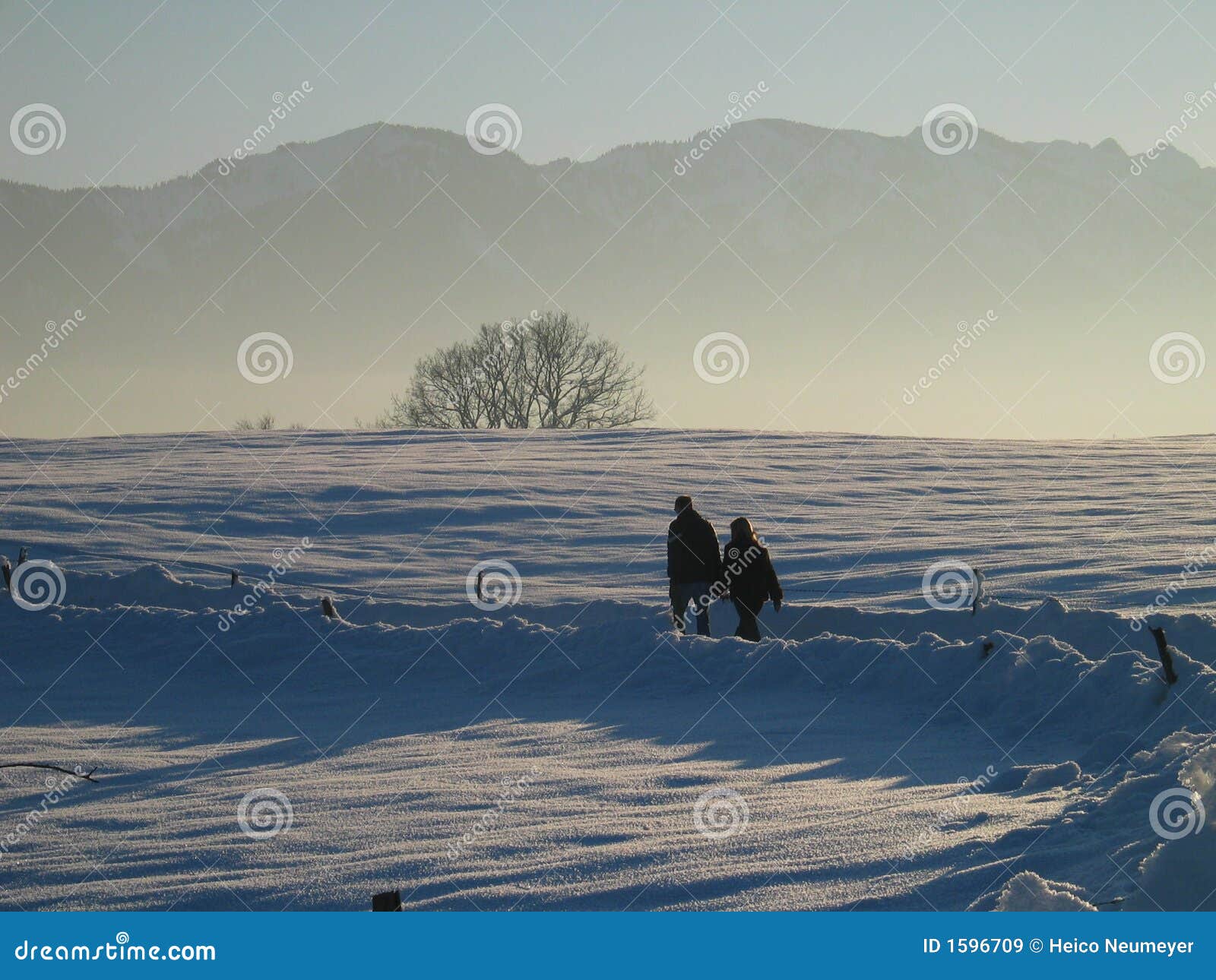 Two People Walking in Lonely Snow and Mountain Landscape Stock Image ...