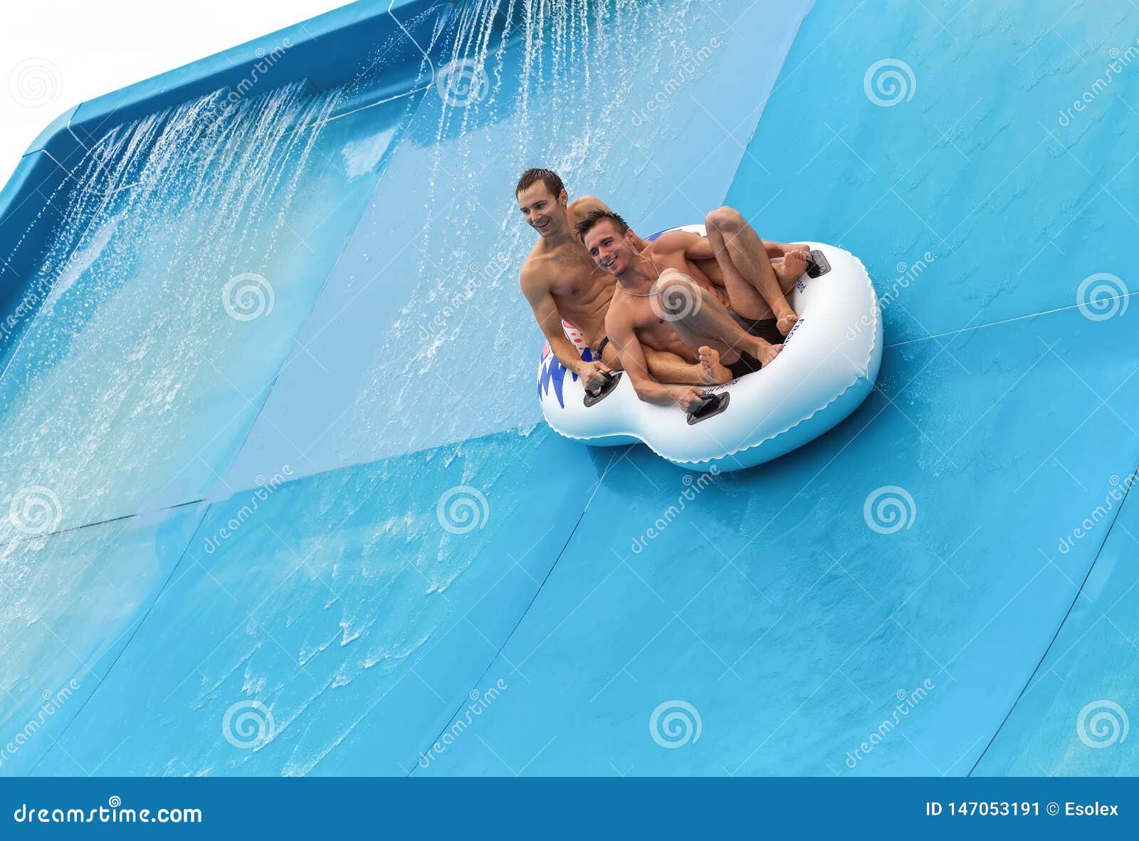 Two People in a Water Slider Stock Image - Image of outside, resort ...