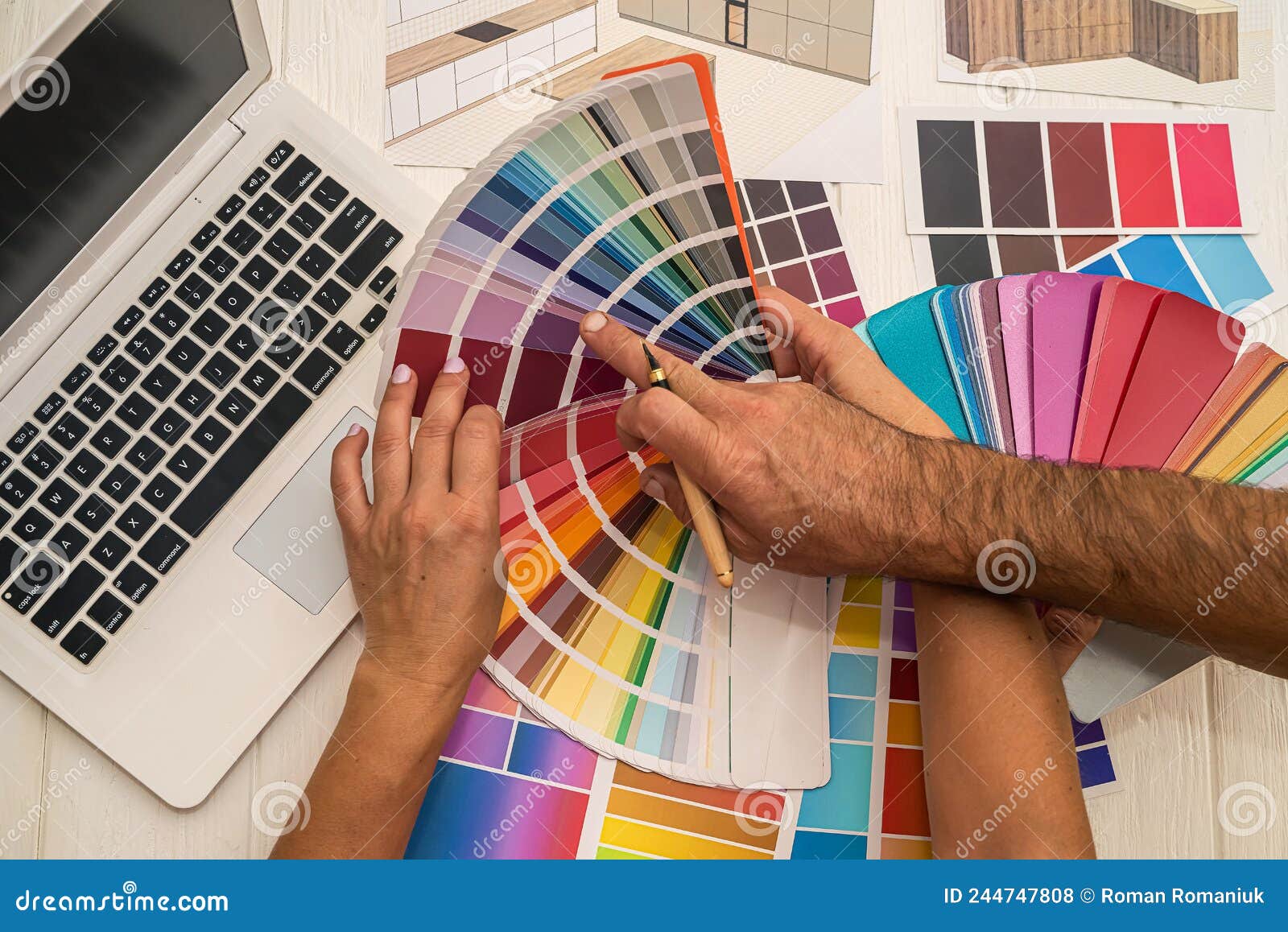 Two People Working Drawing on Blueprint and Discussing the Floor Plans ...