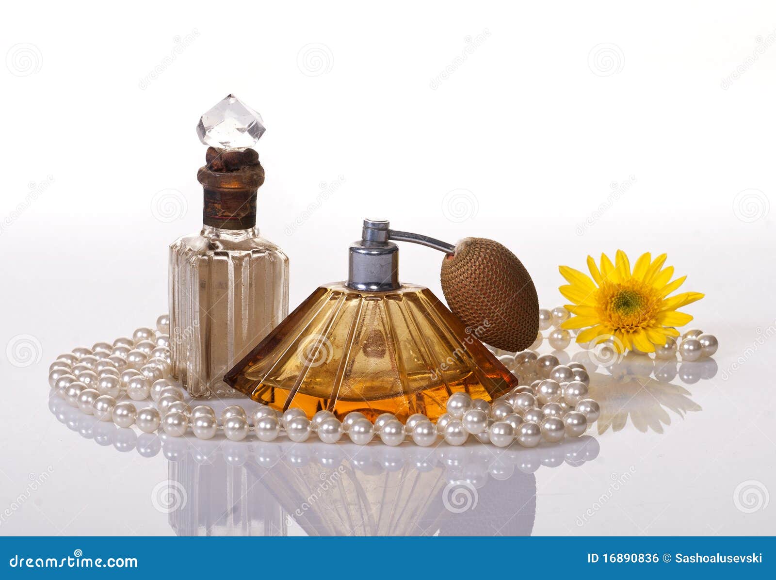 TWO PERFUME BOTTLES, PEARLS and YELLOW FLOWER Stock Photo - Image of ...