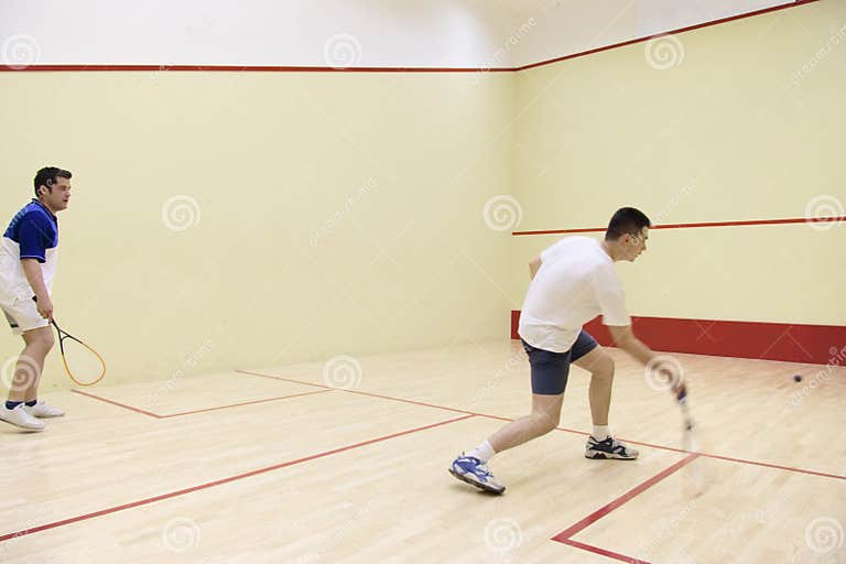 Two person playing squash stock image. Image of effort - 528583