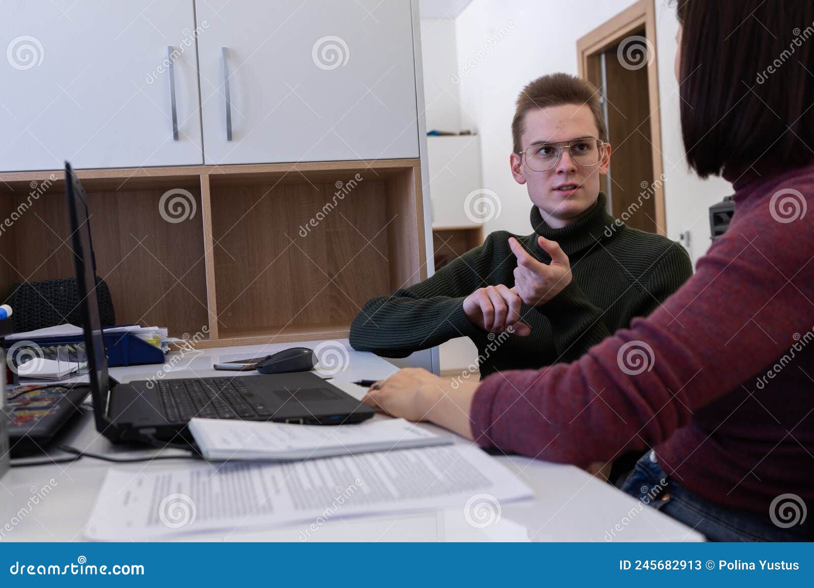 Two persons work in office stock image. Image of face - 245682913