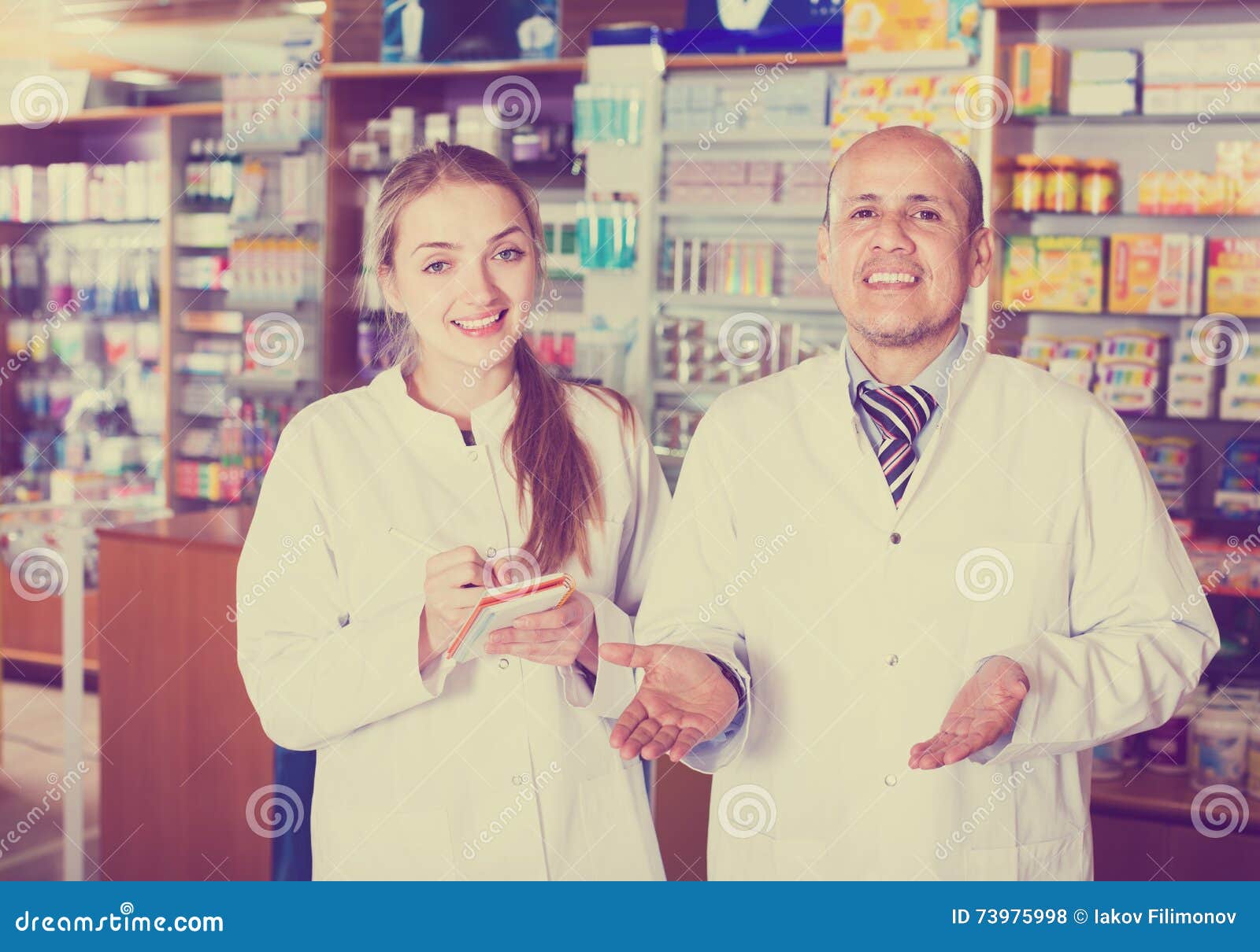 Two Pharmacists in Chemist Shop Stock Photo - Image of coat, people ...