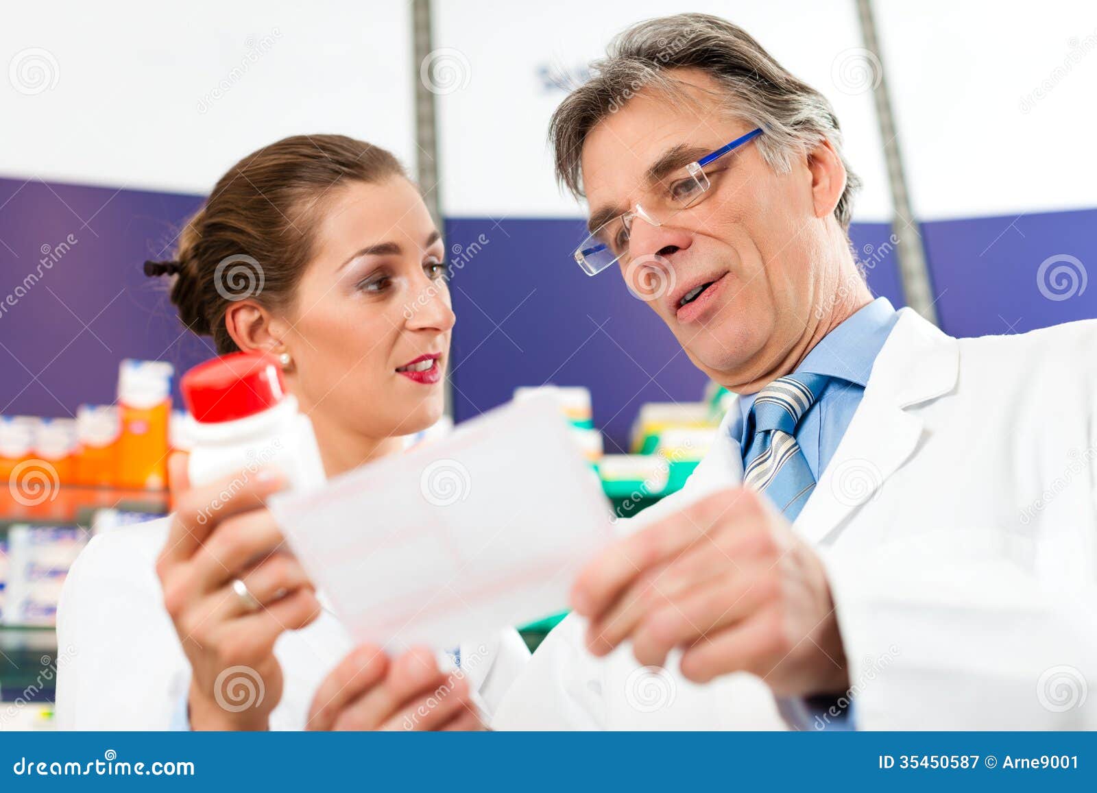 Two Pharmacists in Pharmacy Consulting Stock Image - Image of drug ...