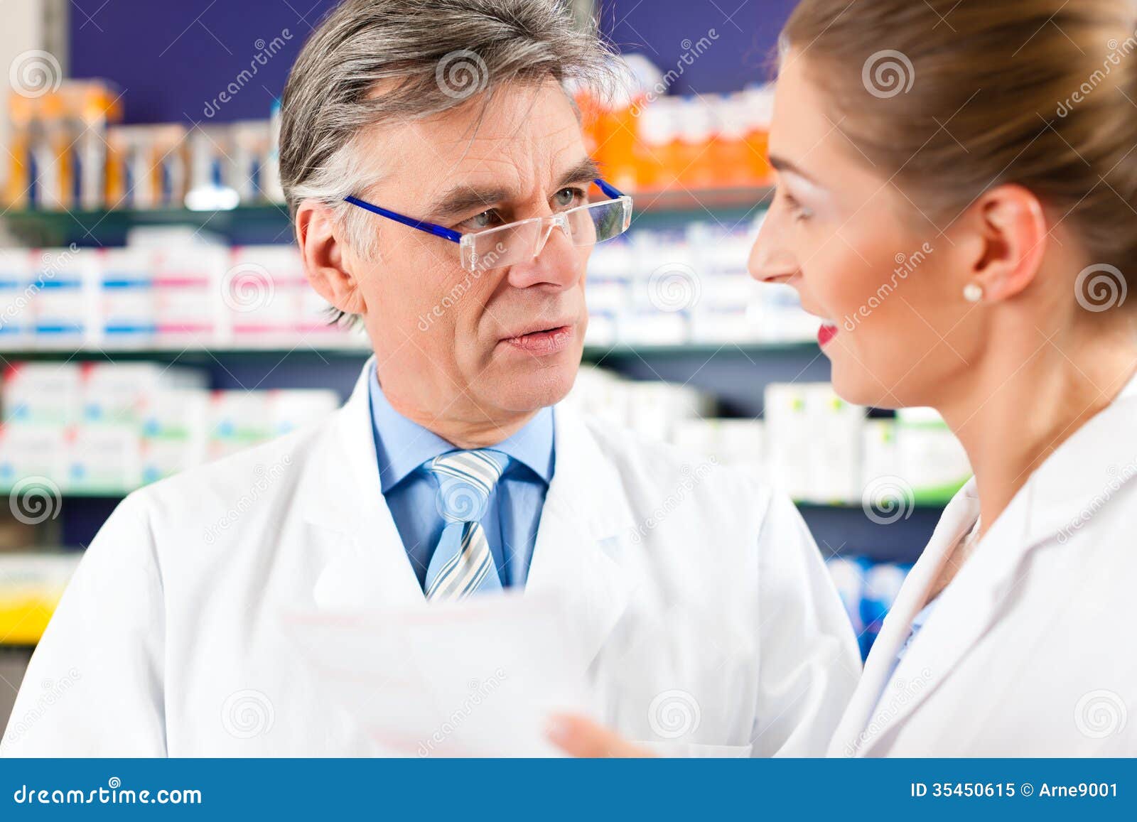 Two Pharmacists in Pharmacy Consulting Stock Image - Image of ...