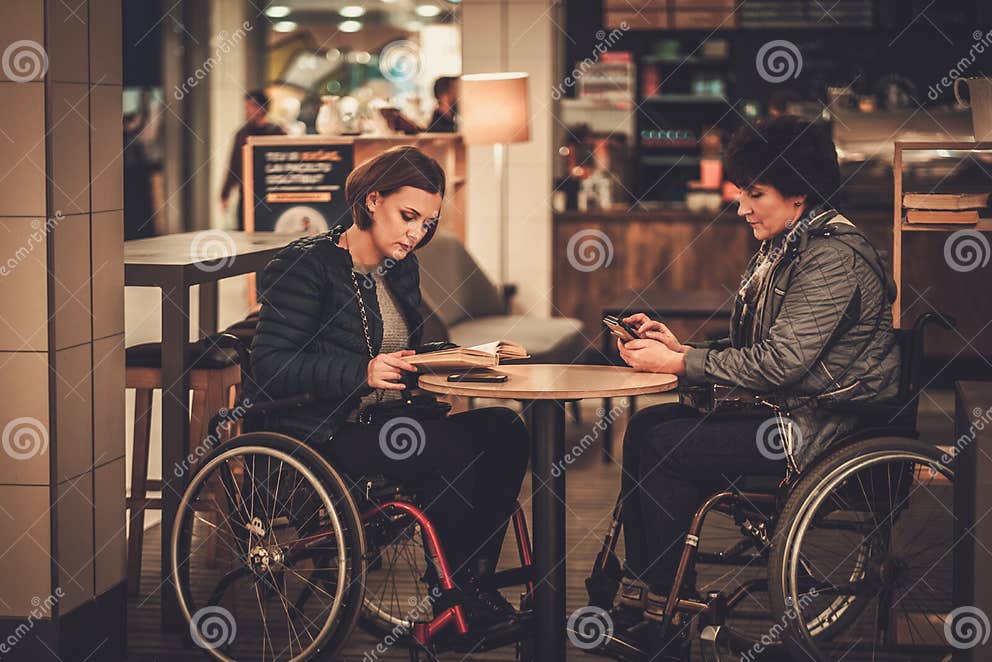 Two Physically Challenged Women in a Cafe Stock Photo - Image of ...