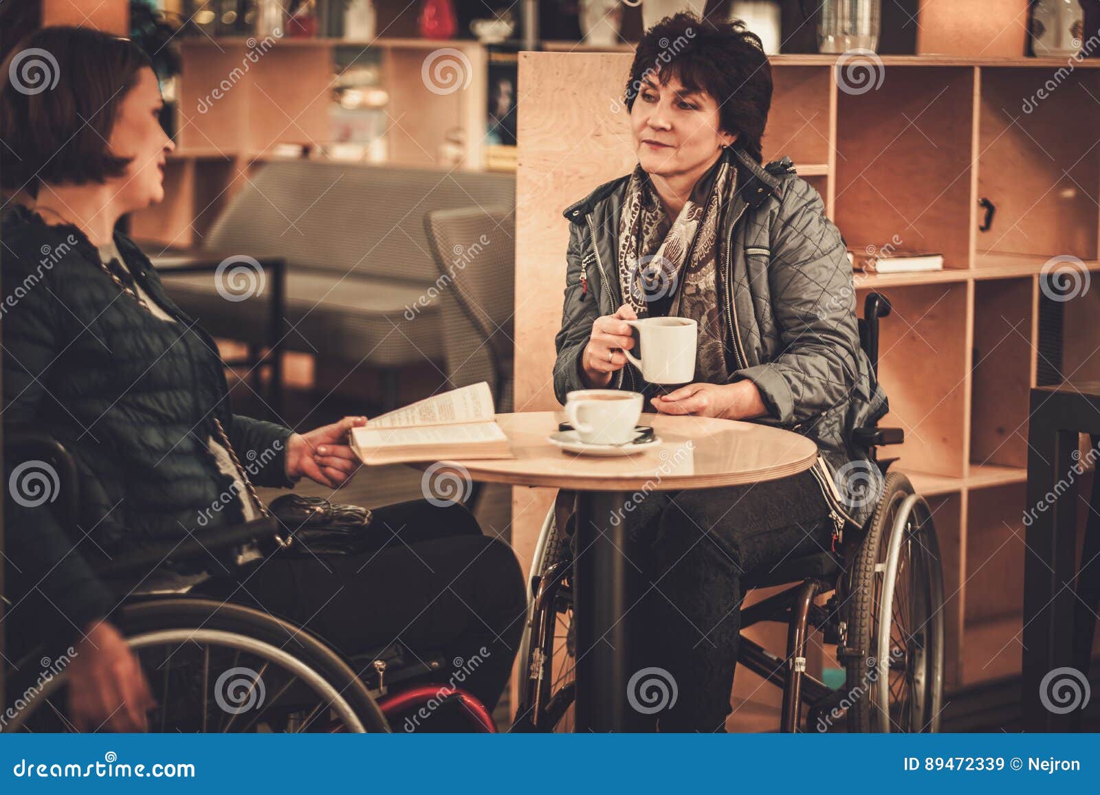 Two Physically Challenged Women in a Cafe Stock Image - Image of ...