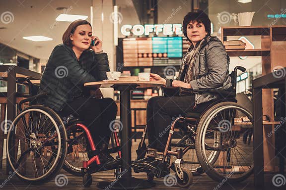 Two Physically Challenged Women in a Cafe Stock Image - Image of ...