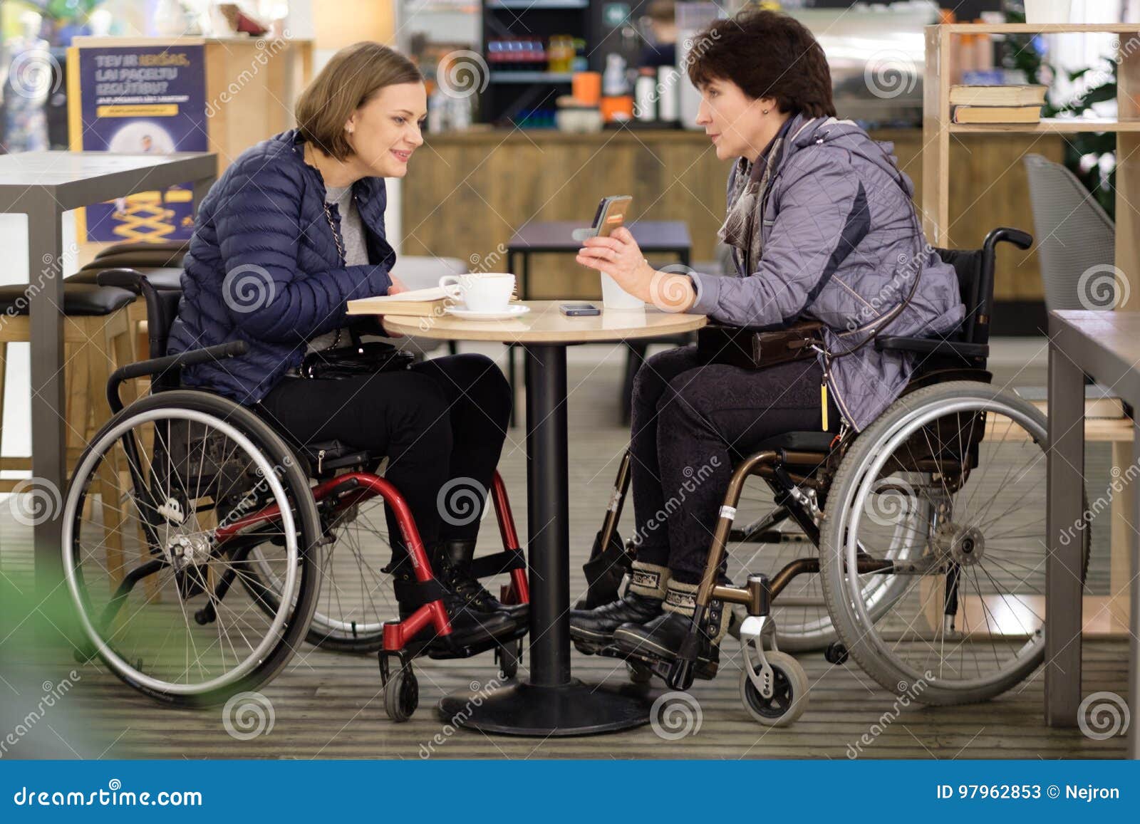 Two Physically Challenged Women in a Cafe Stock Image - Image of ...