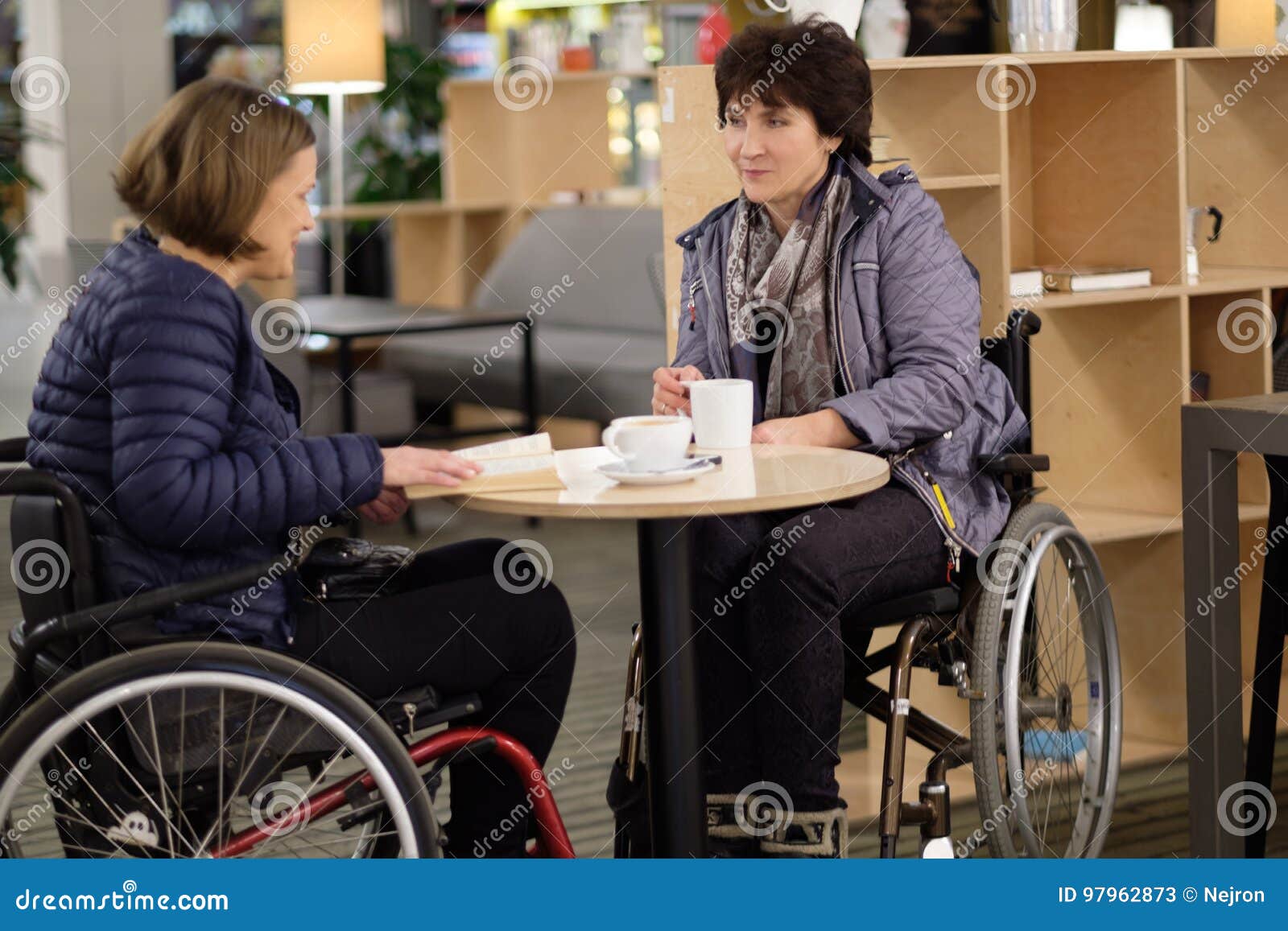 Two Physically Challenged Women in a Cafe Stock Image - Image of cafe ...