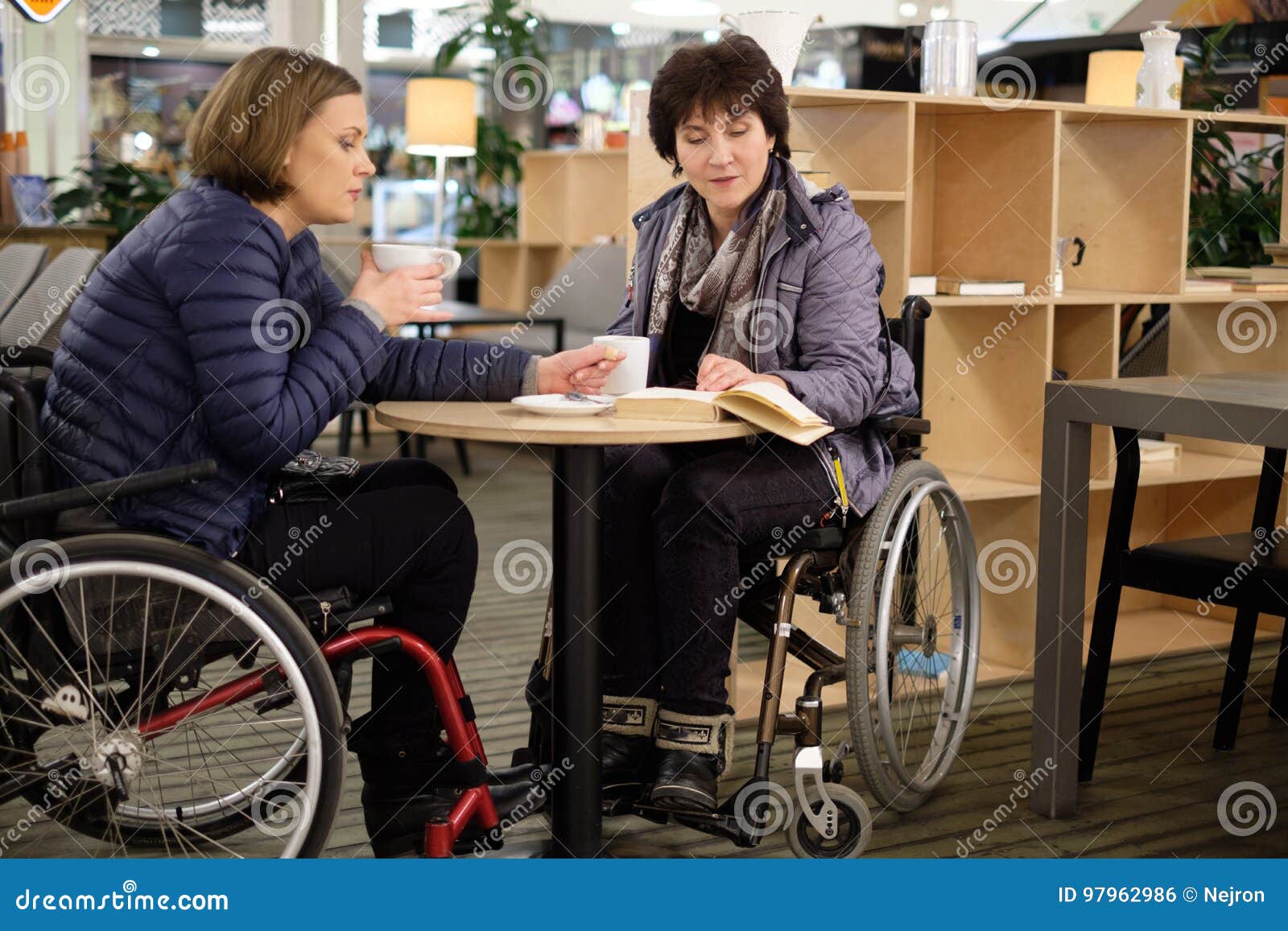 Two Physically Challenged Women in a Cafe Stock Photo - Image of ...
