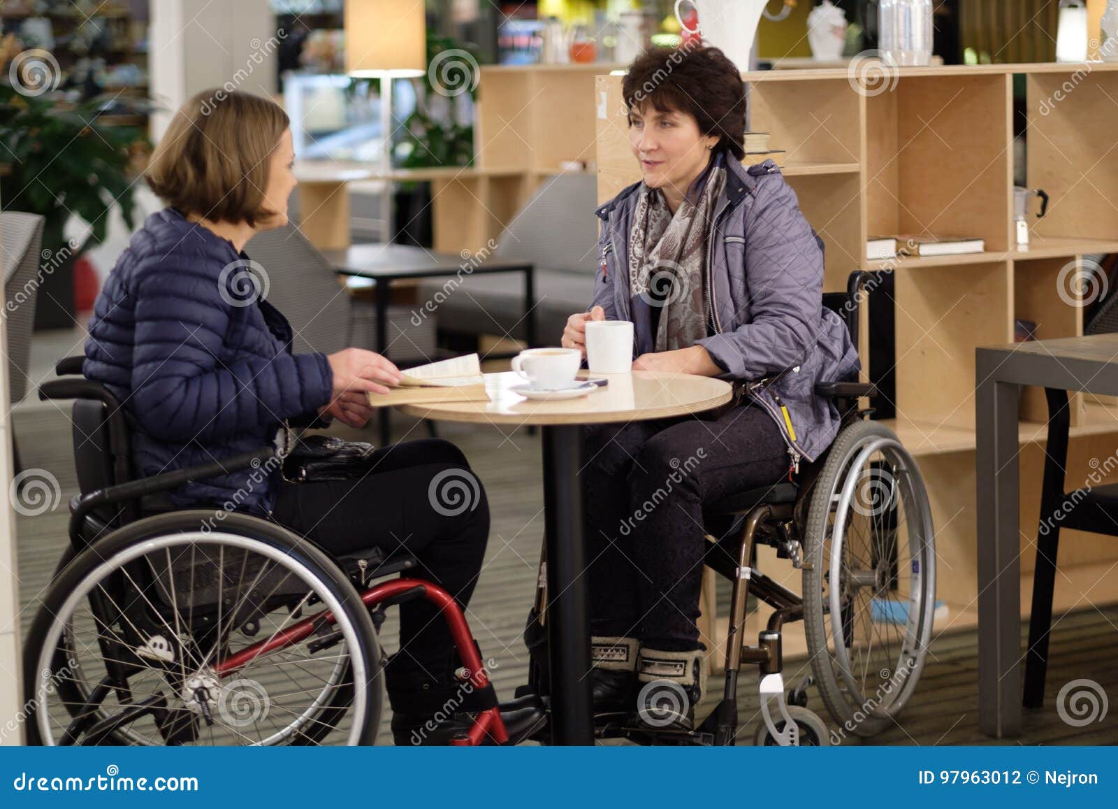 Two Physically Challenged Women in a Cafe Stock Photo - Image of ...