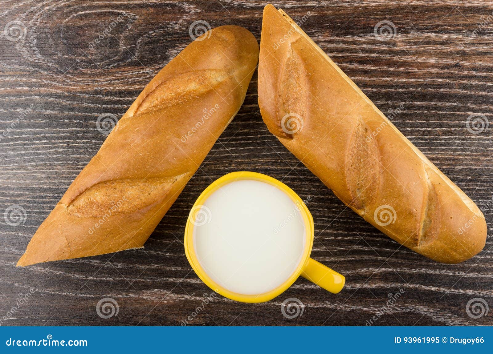 Two Pieces of Bread and Cup with Milk on Table Stock Image - Image of ...
