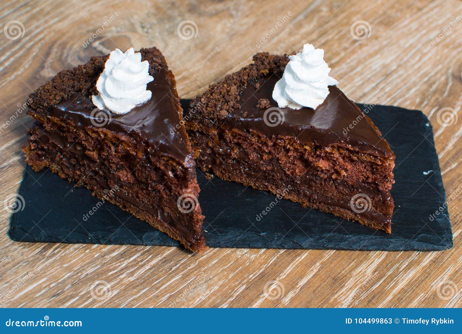 Two Pieces of Cake on a Stone Plate Stock Image - Image of dark ...