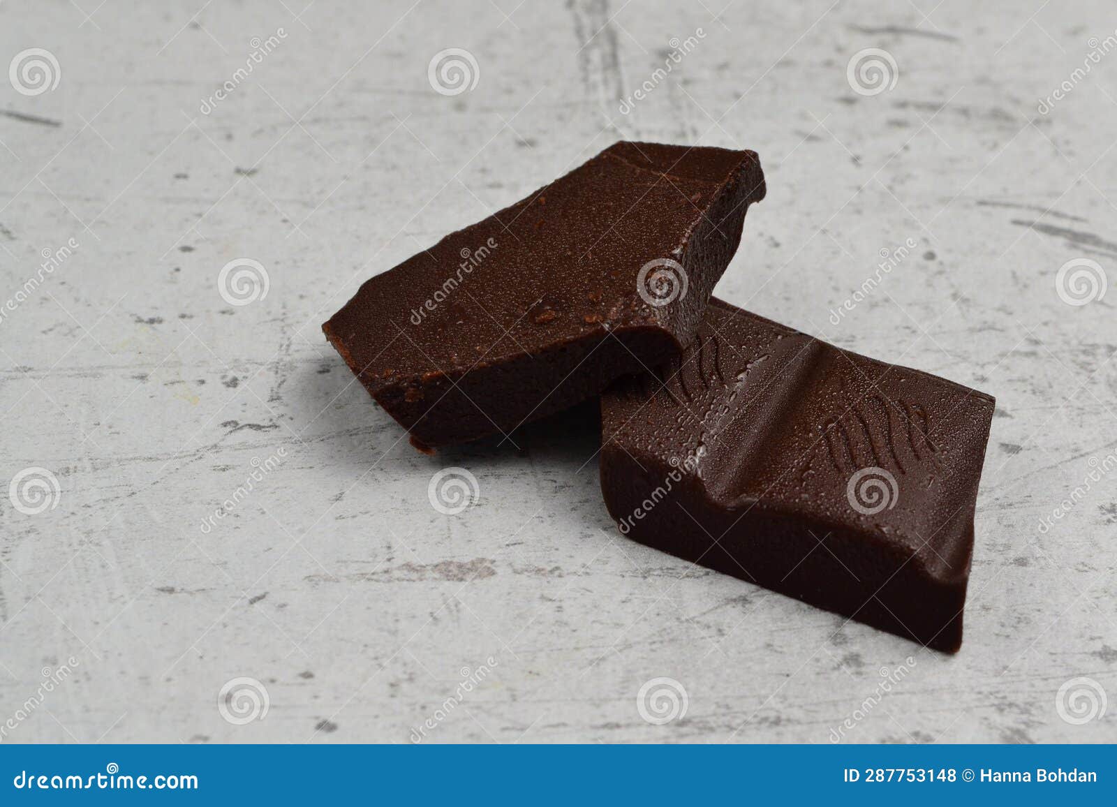 Two Pieces of Chocolate on a Light Background Stock Photo - Image of ...