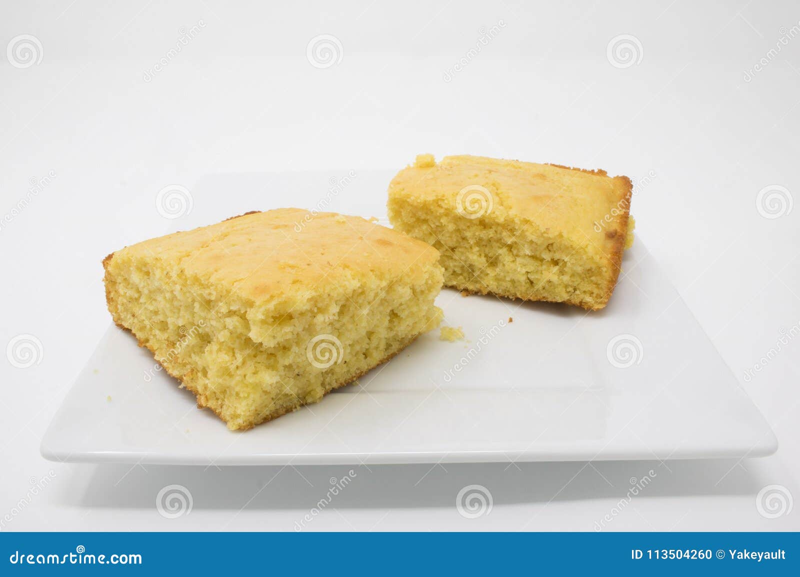 Cornbread on a white plate stock photo. Image of white - 113504260