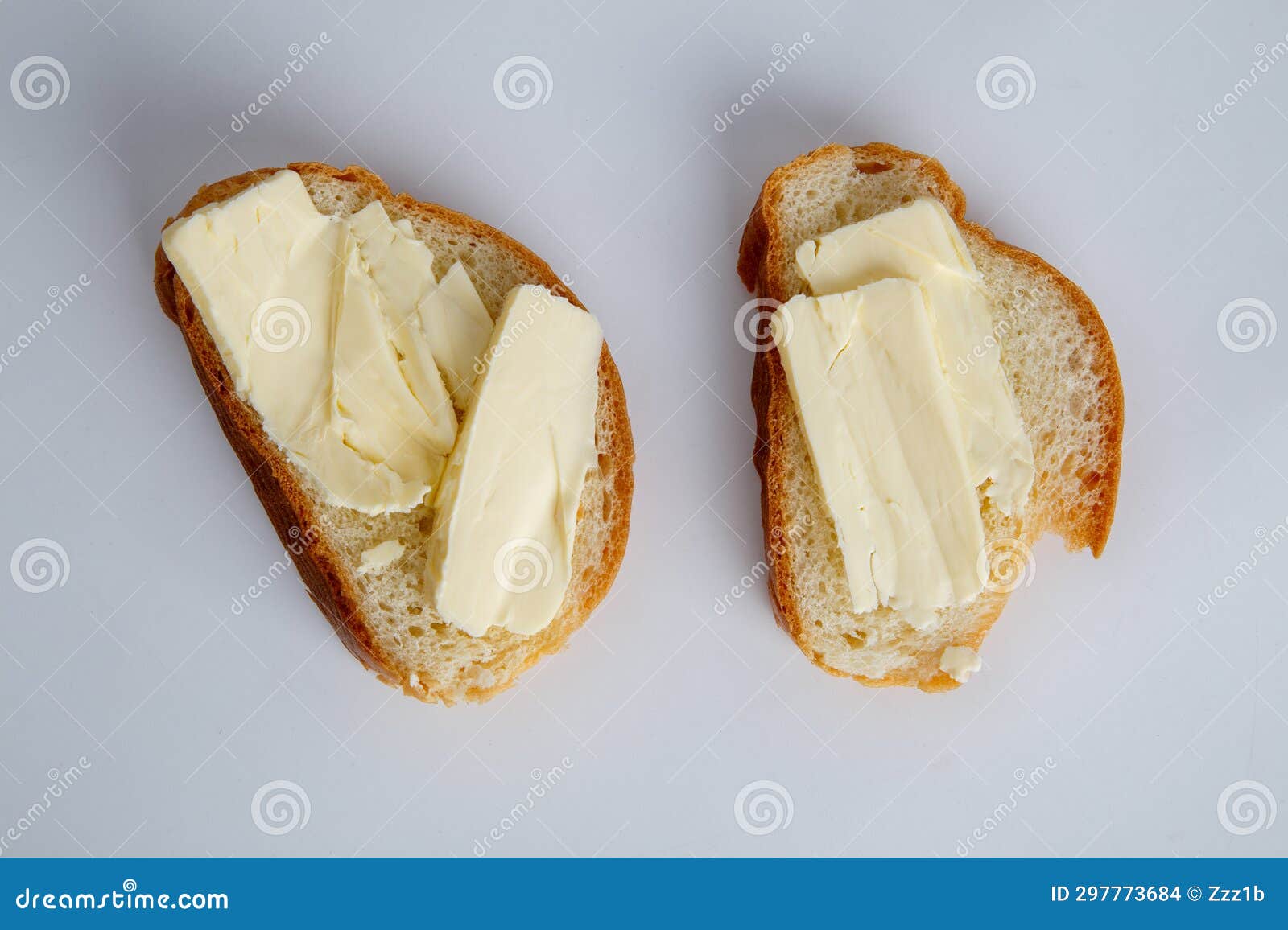 Two Pieces of White Bread with Butter on White Background Stock Photo ...