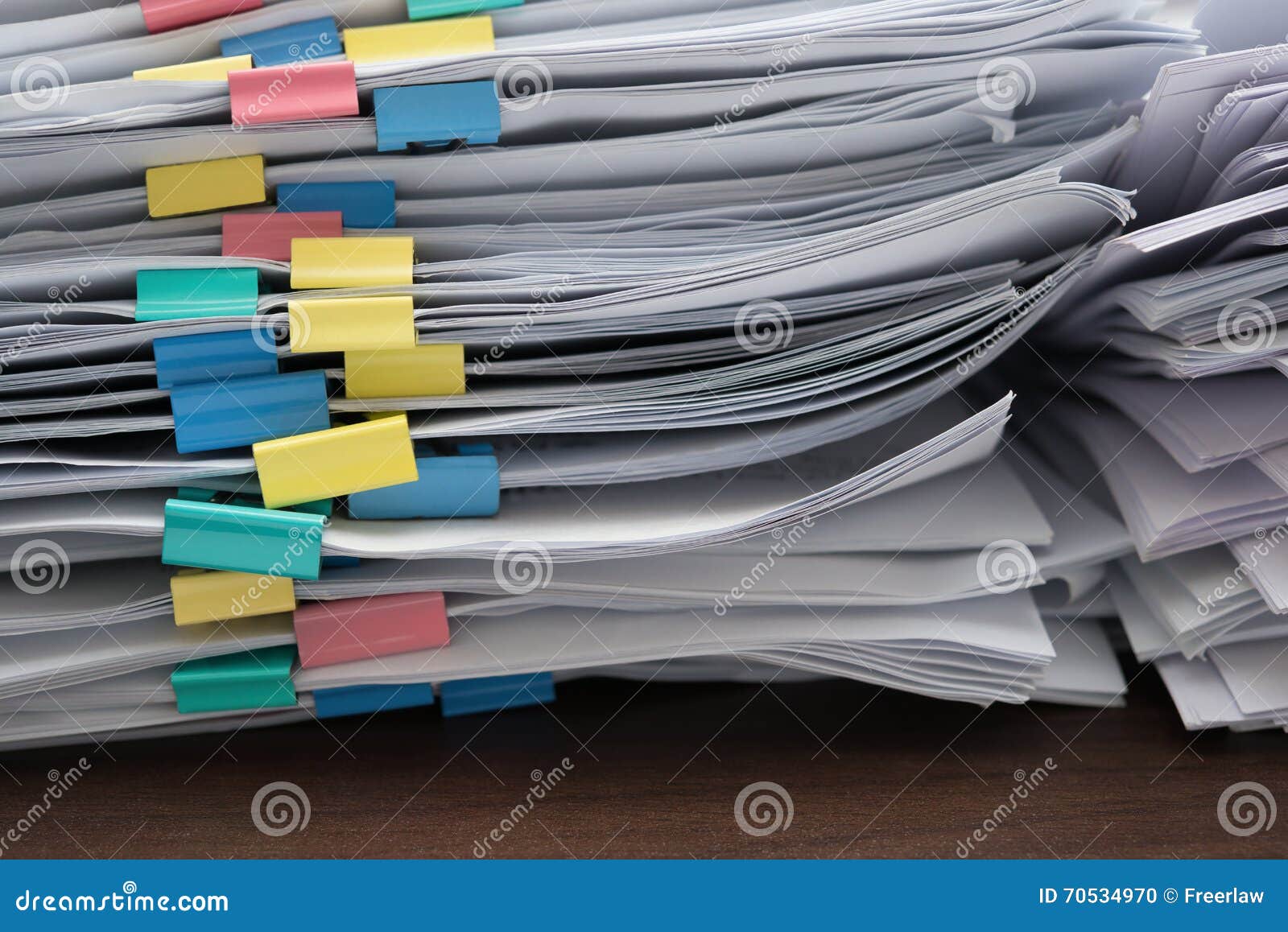 Two Piles of Documents with Colorful Clips on Desk Stock Photo - Image ...