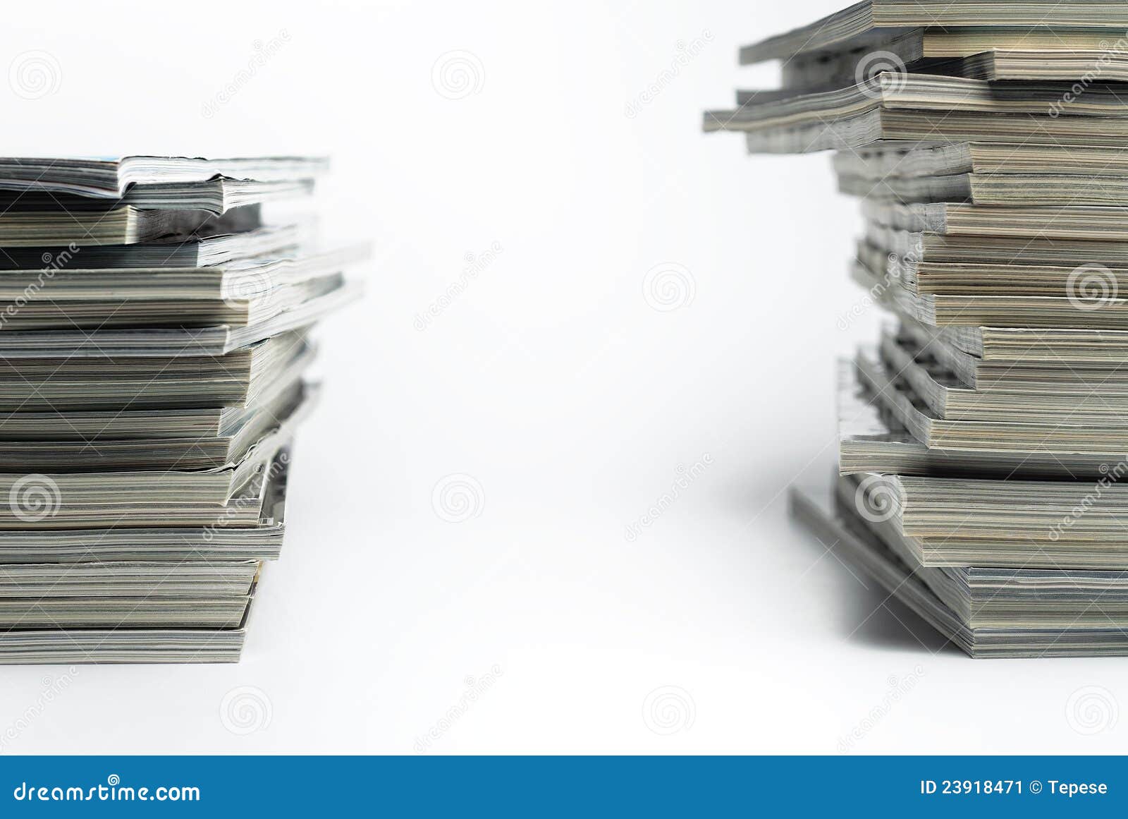 Two Piles of Magazines stock image. Image of paper, publication - 23918471