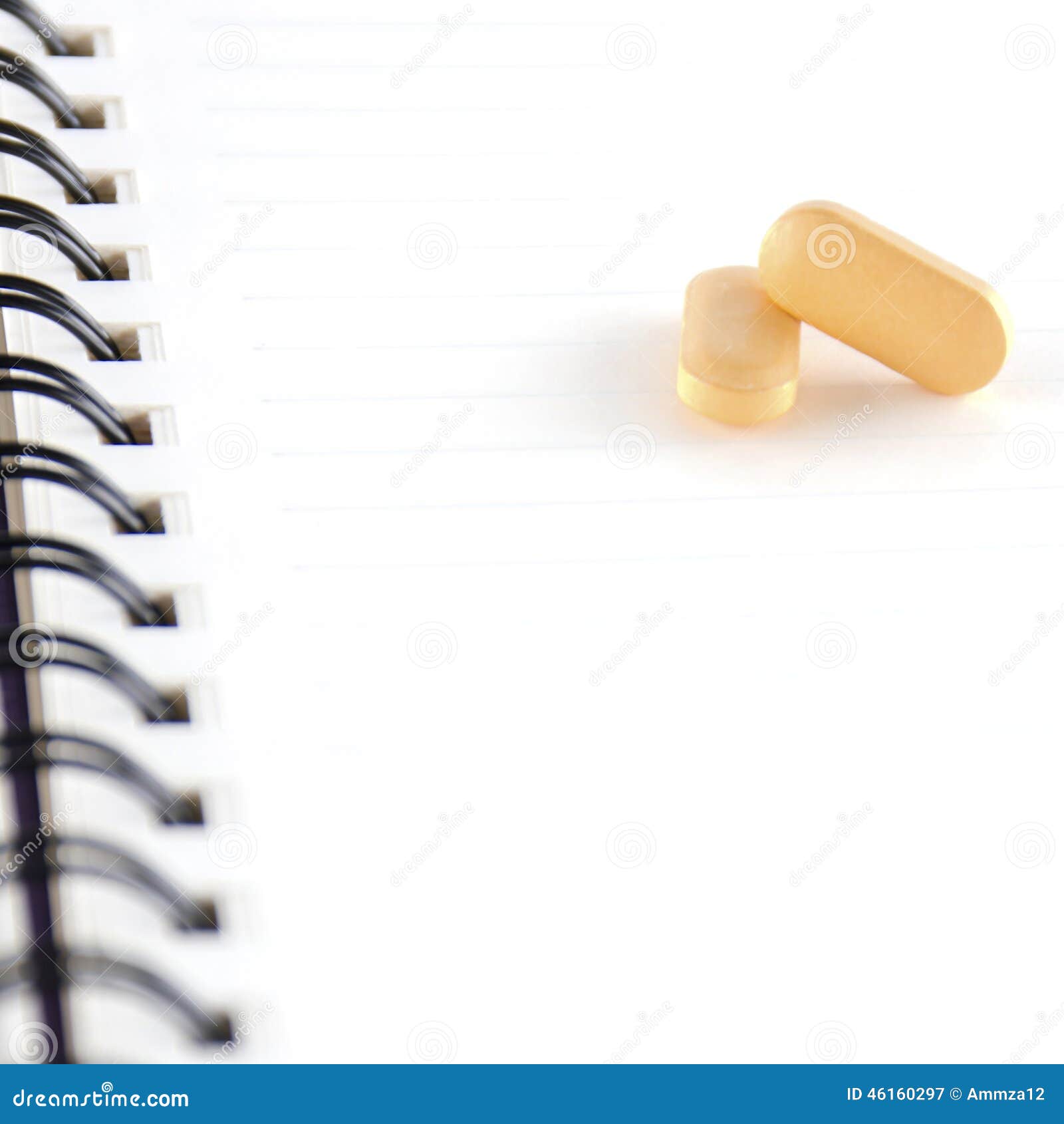 Two pills on notebook stock image. Image of pills, drug - 46160297