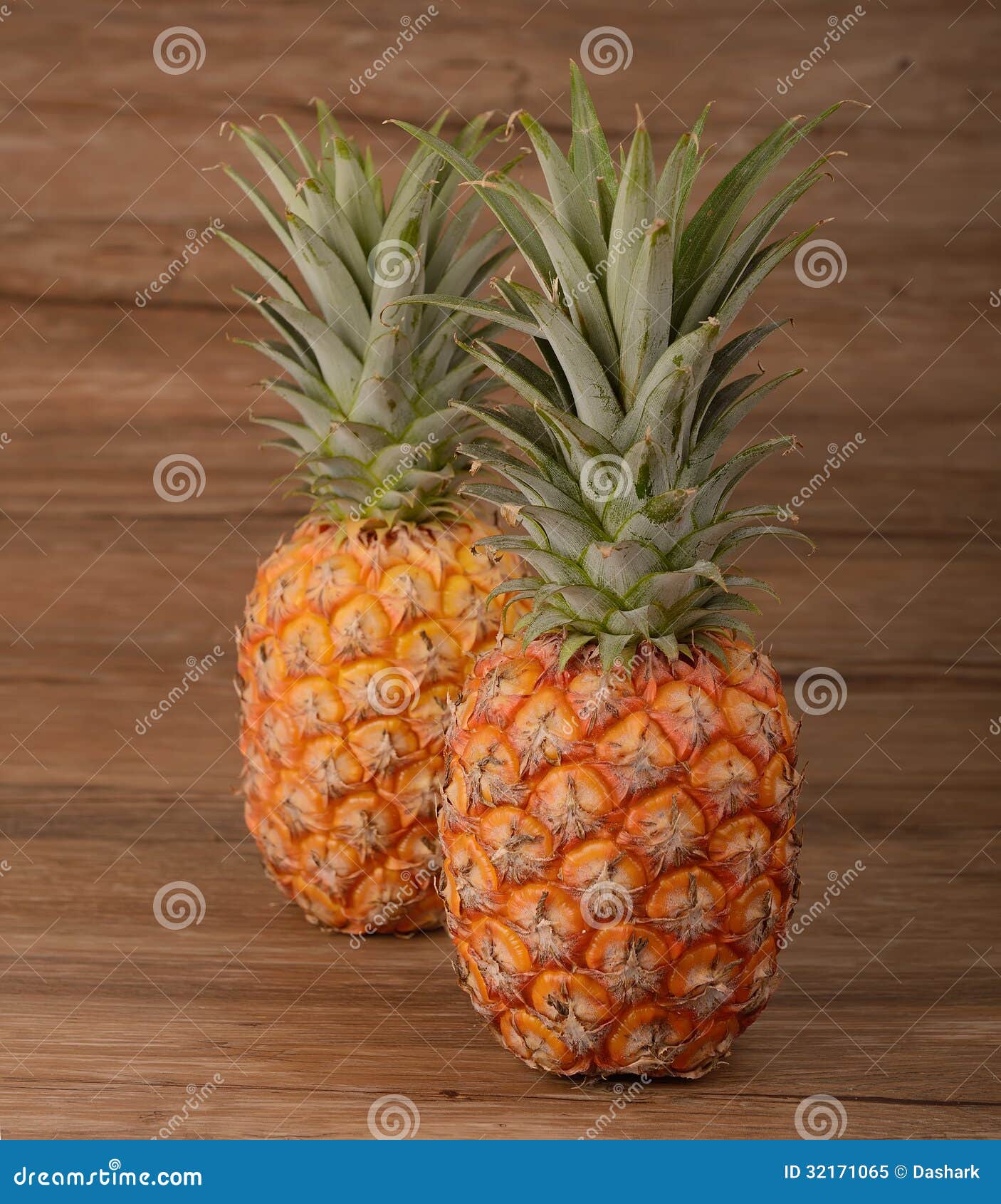 Two Pineapples on wood stock image. Image of food, display - 32171065