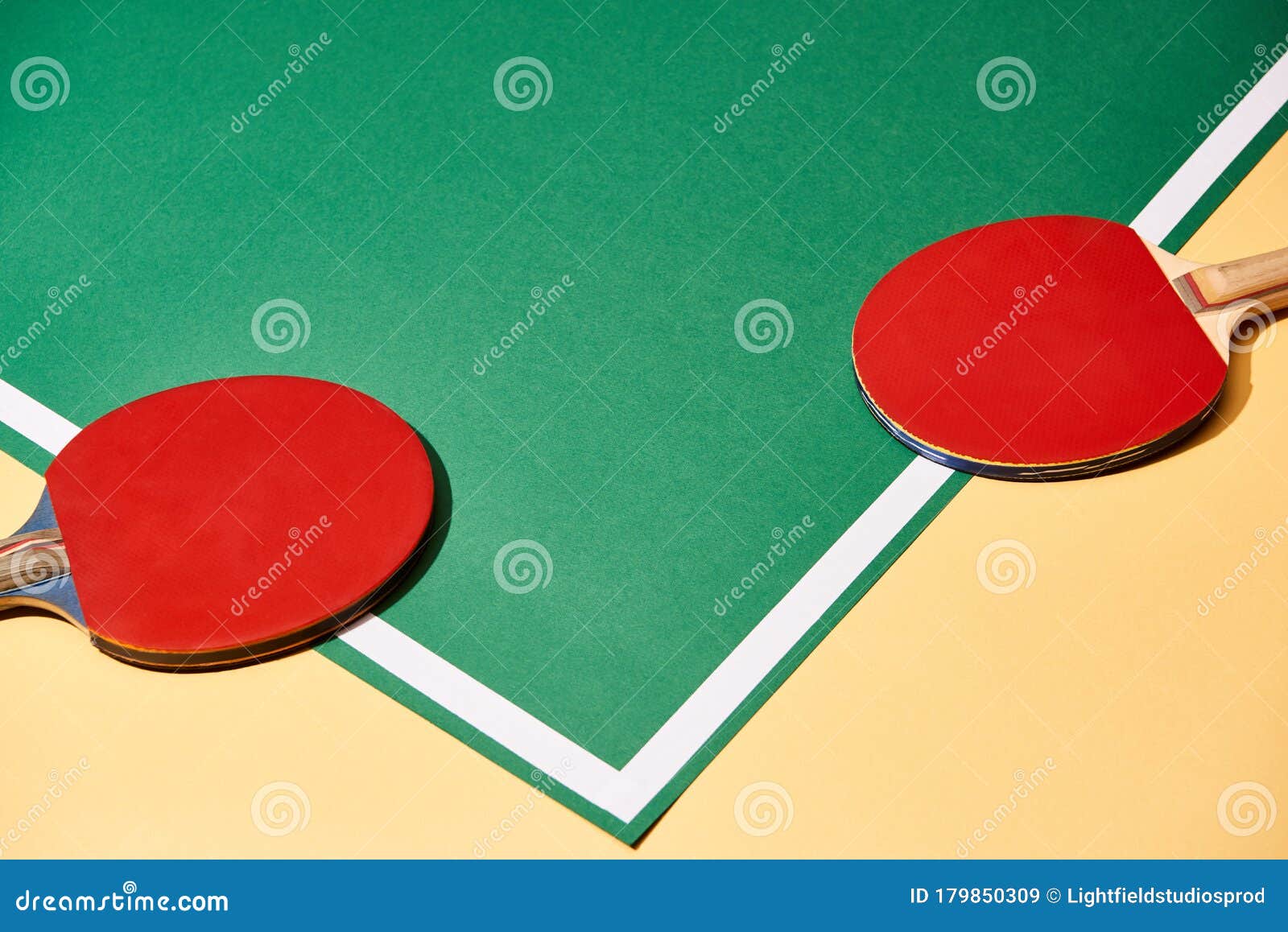 Two Ping Pong Rackets on Yellow and Green Stock Image - Image of ...