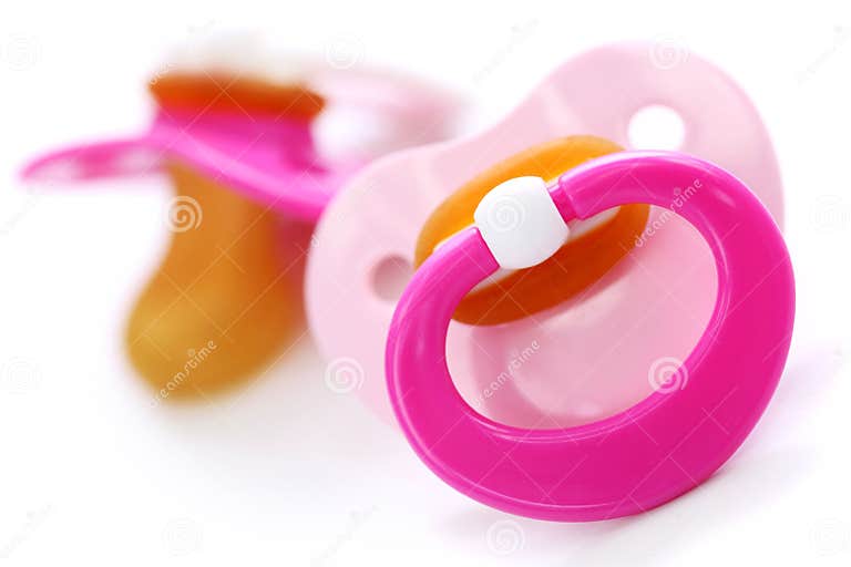 Two pink dummies stock photo. Image of child, soother - 15304330