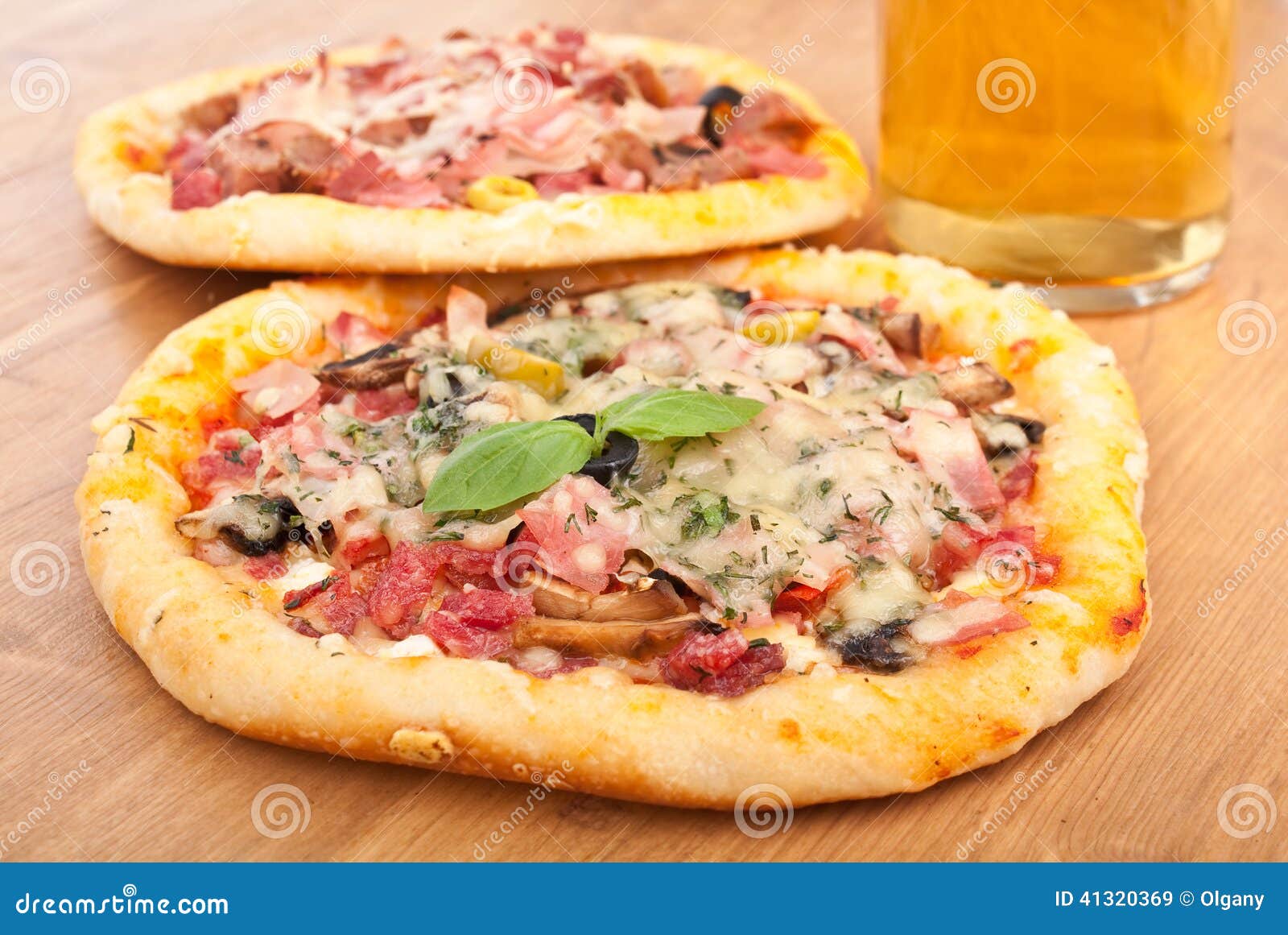 Two Pizzas and a Glass of Beer Stock Image - Image of dinner ...