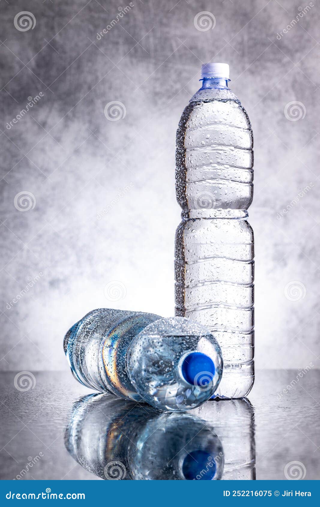 Two Plastic Cold Bottles of Water with Water Drops Stock Image - Image ...