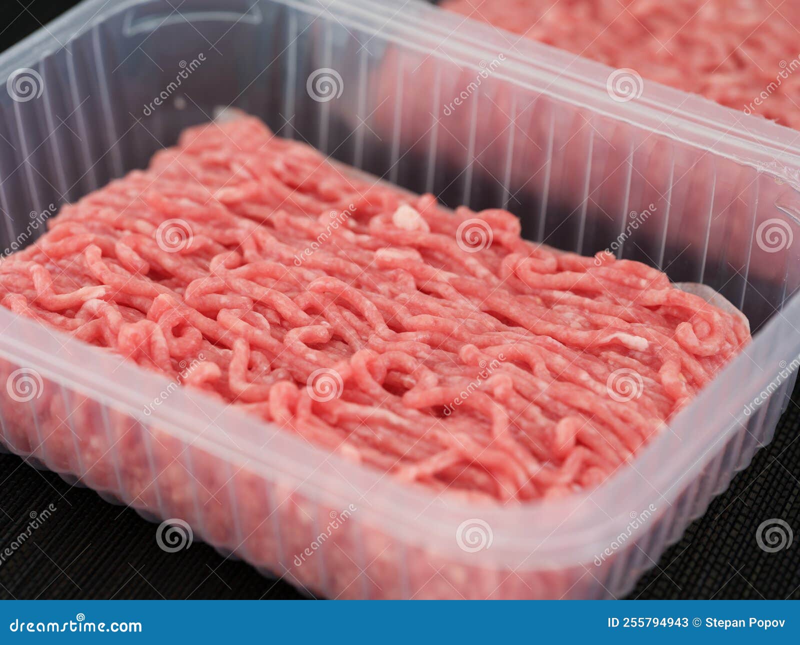 Two Plastic Containers with Minced Pork and Beef in Them Lying on a ...