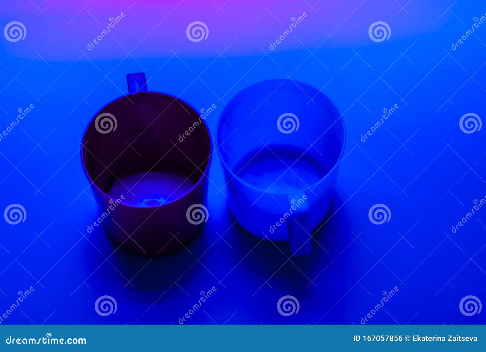 Two Plastic Cups on Blue Background. Conceptual Image with Copy Space ...