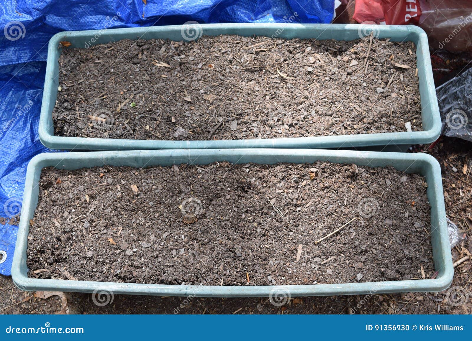 Two Plastic, Dirt Filled Planter Boxes Stock Photo - Image of garden ...