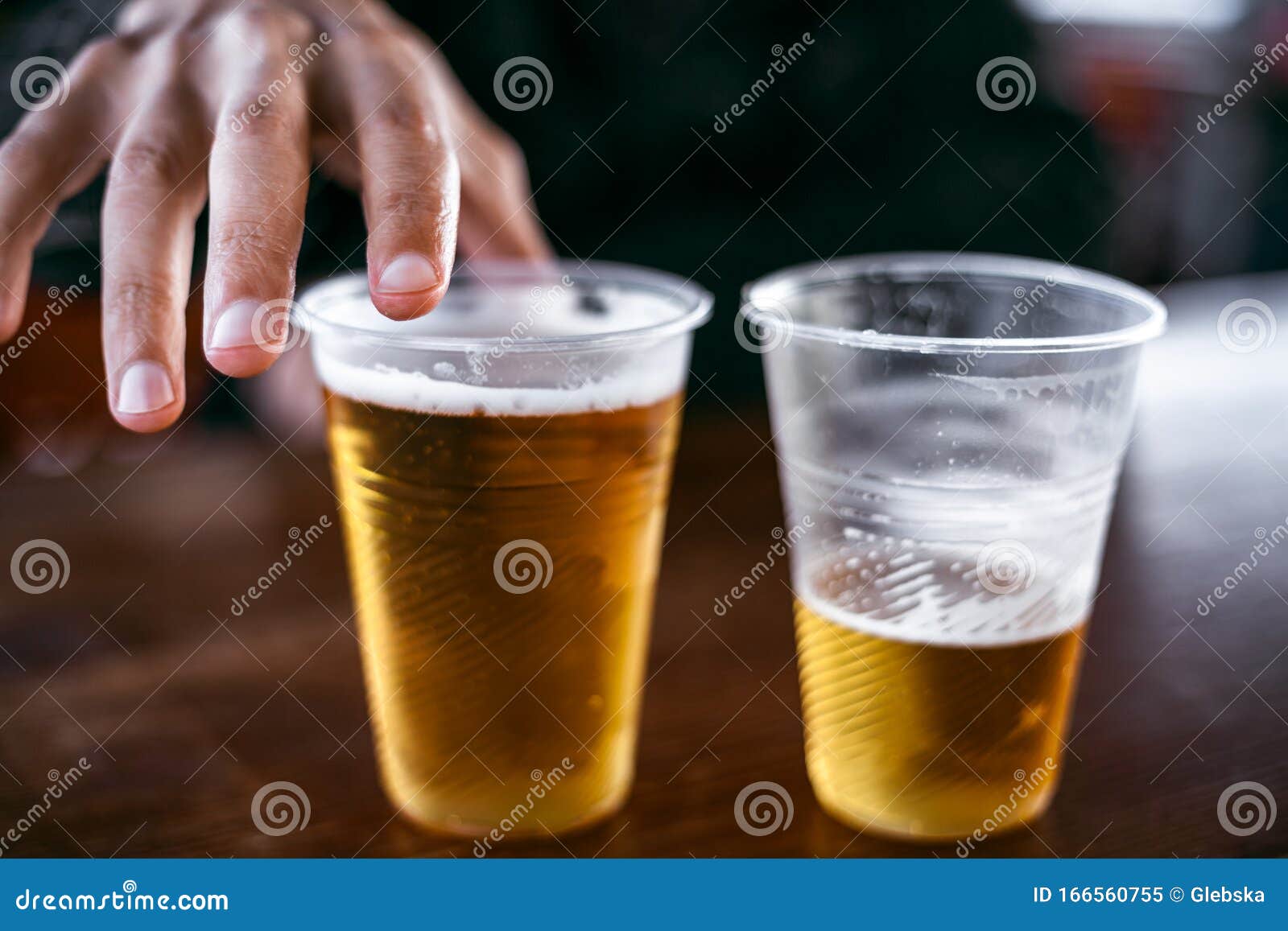 Two Plastic Glasses with Beer Stand Side by Side Stock Image - Image of ...