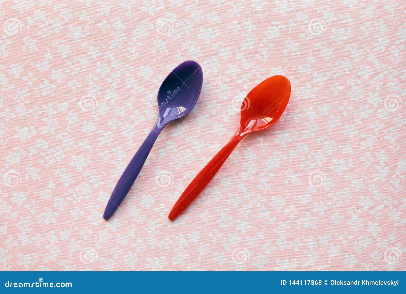 Two Plastic Spoons for Children on a Fabric Background Stock Photo ...
