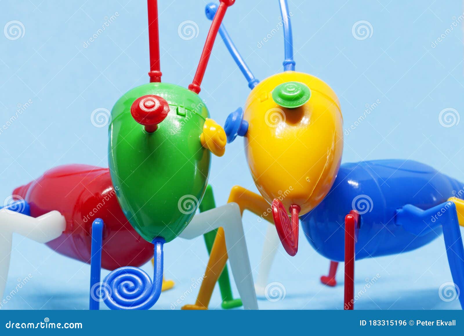 Two Plastic Toys Representing Fleas on a Blue Background Stock Photo ...