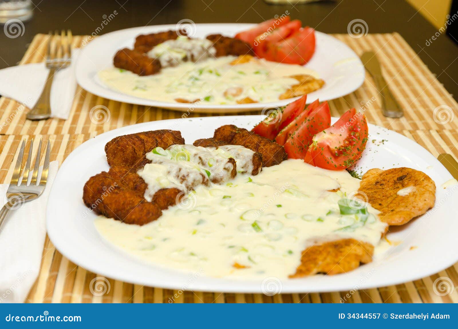 Two plates of main course stock image. Image of braised - 34344557