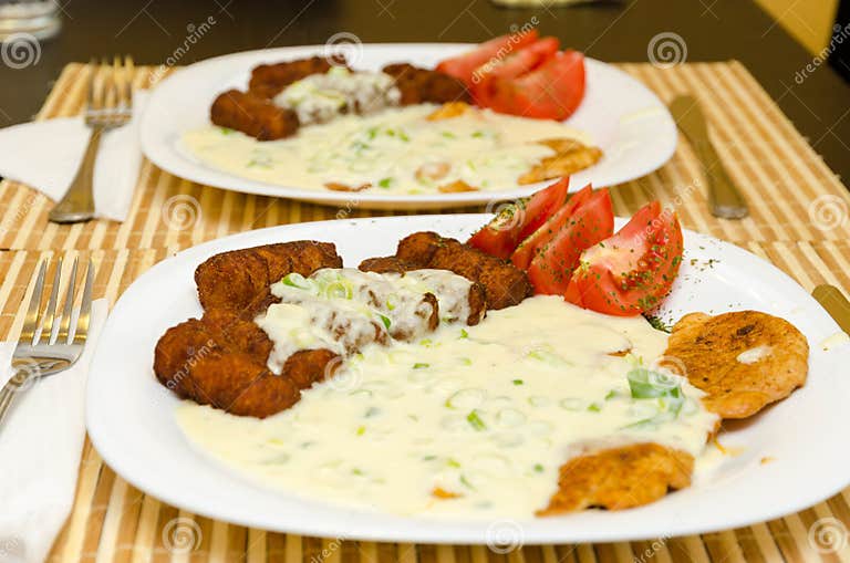 Two plates of main course stock image. Image of braised - 34344557