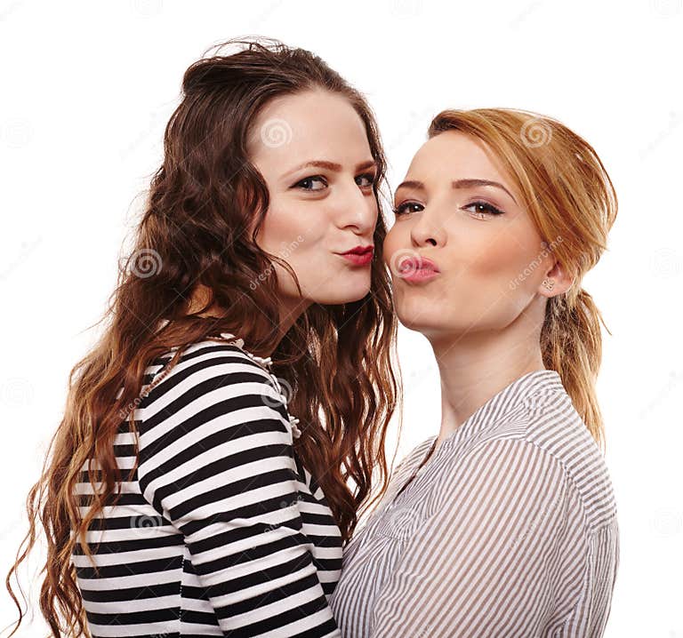 Two Playful Girlfriends Hugging And Kissing Each Other Stock Image