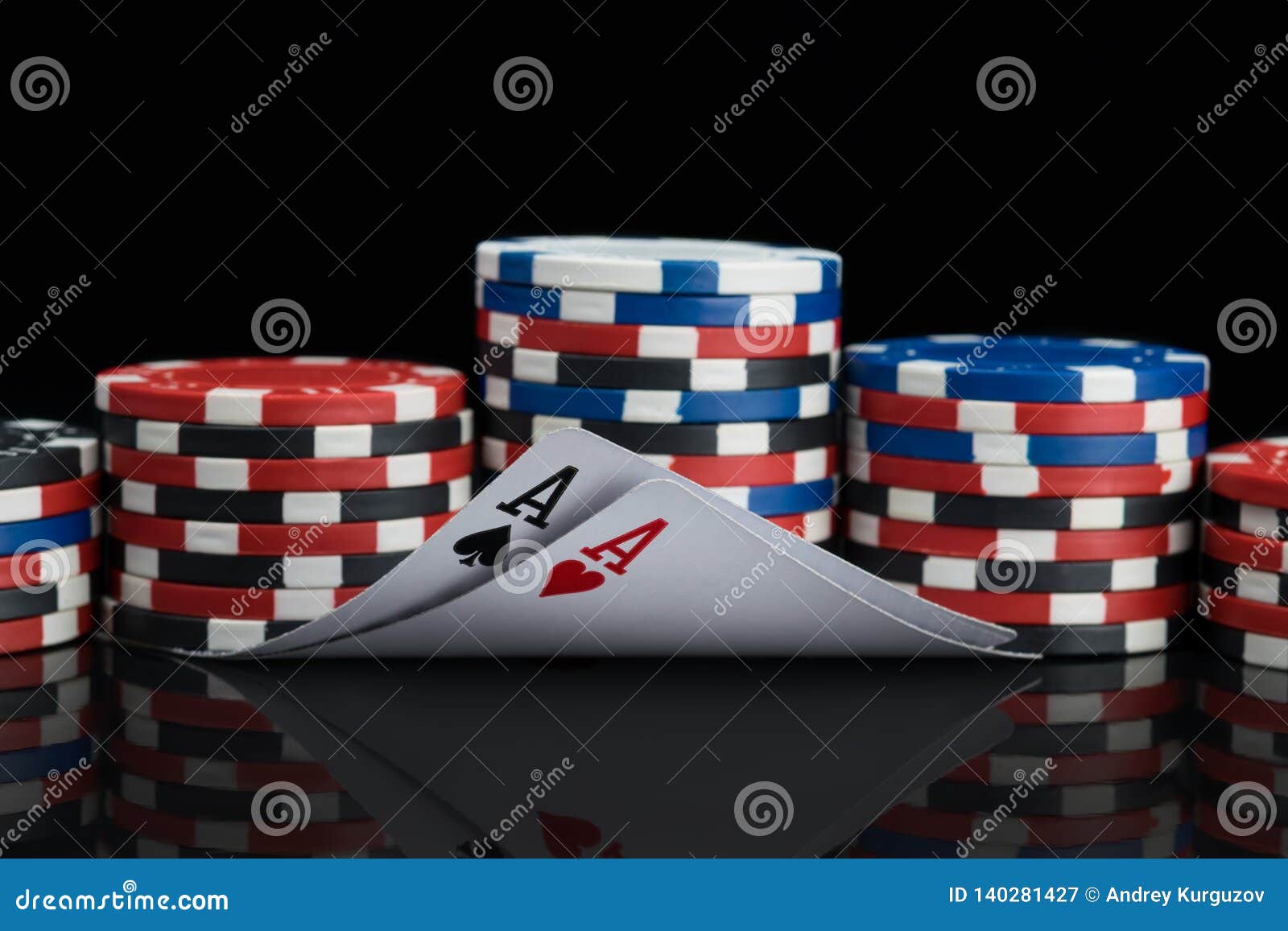 Two Playing Cards and Neat Stacks of Chips and Their Reflection in a ...