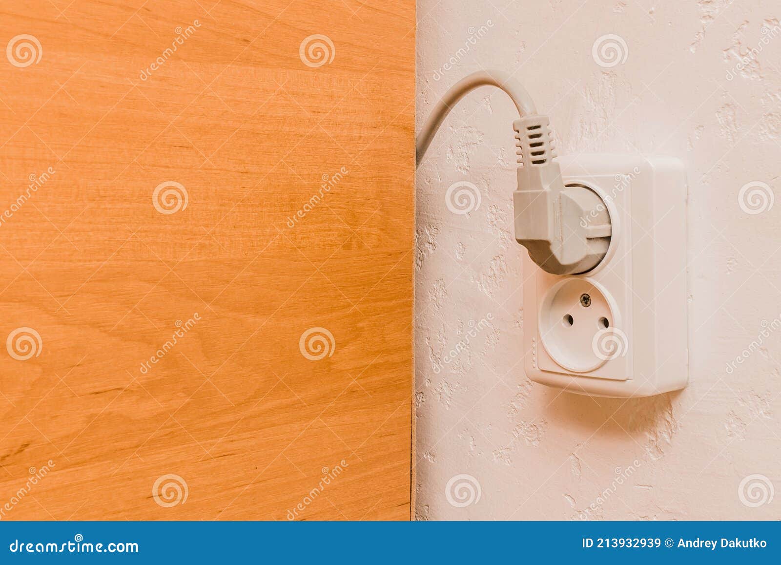Two Plugs in the Socket in a Modern Interior. Safe Connection of ...