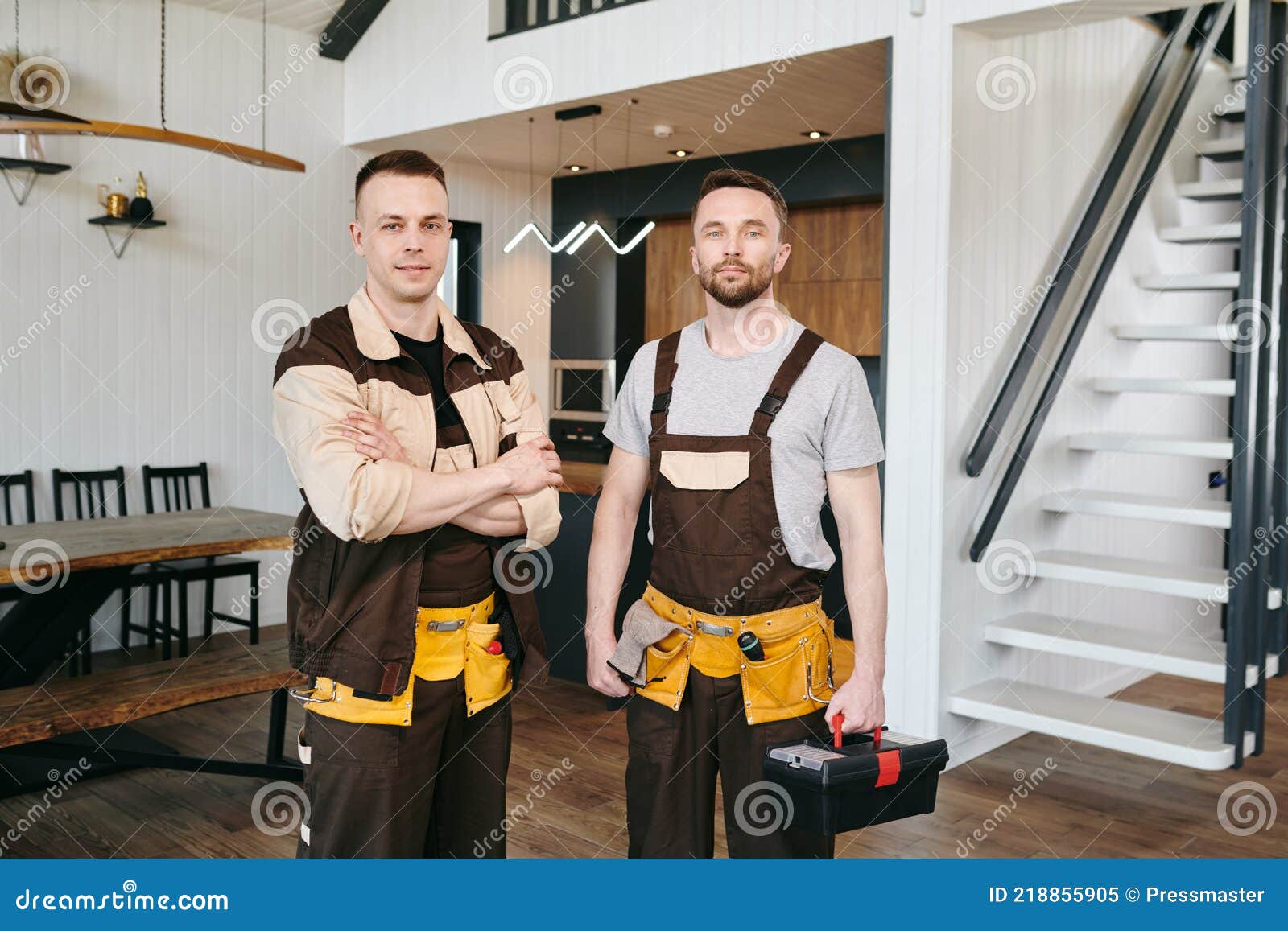 Two Plumbers in Uniform Standing in Front of Camera Stock Image - Image ...