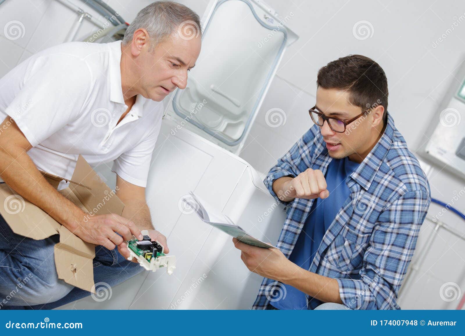 Two plumbers working stock photo. Image of tiling, hammer - 174007948